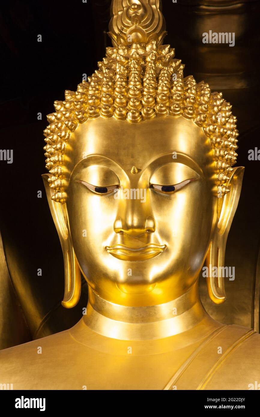 Close up of golden Buddhist statue face Stock Photo - Alamy