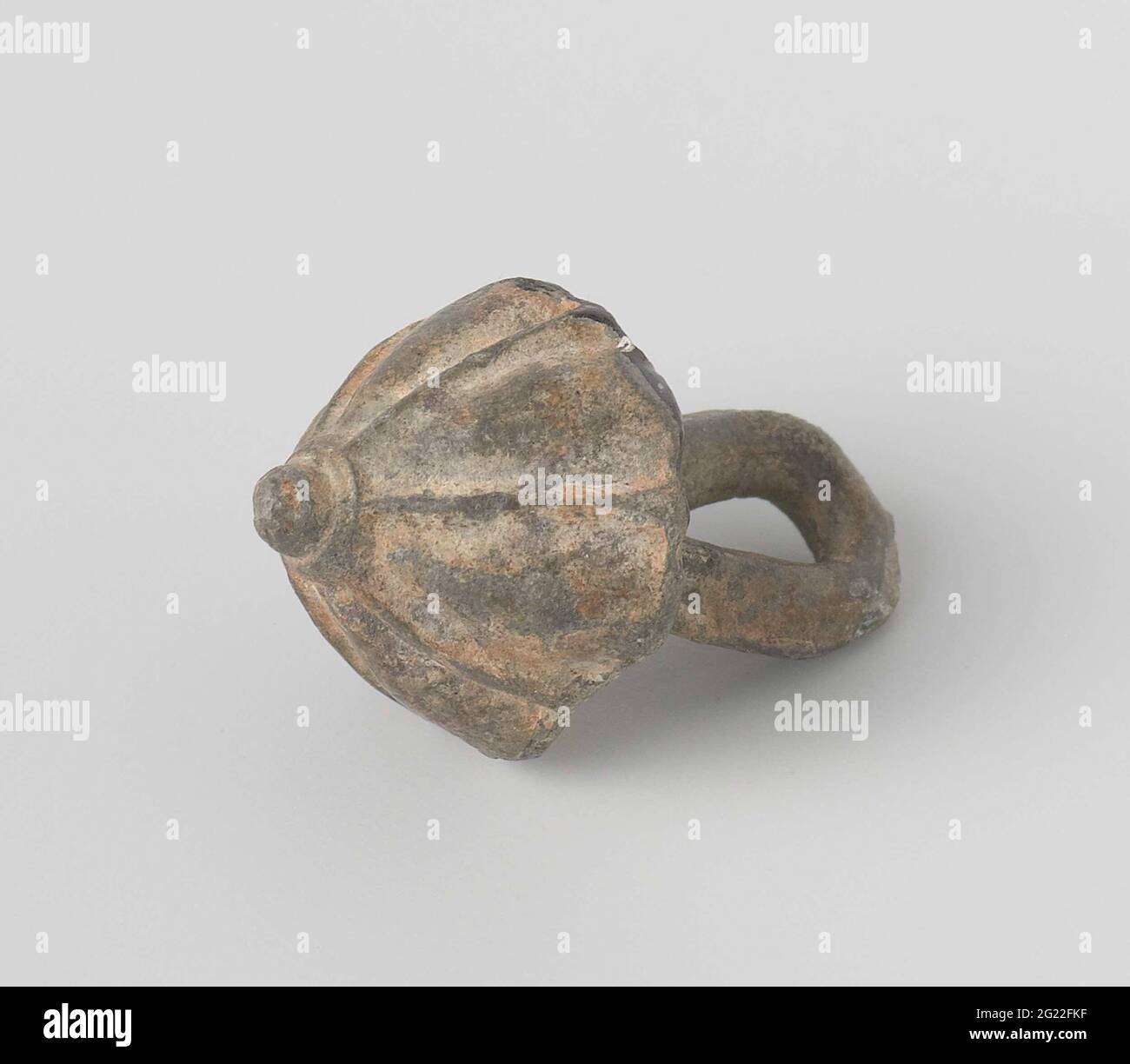Button, conical with ribs and a leafy eye. Knot, conical shape with six ...