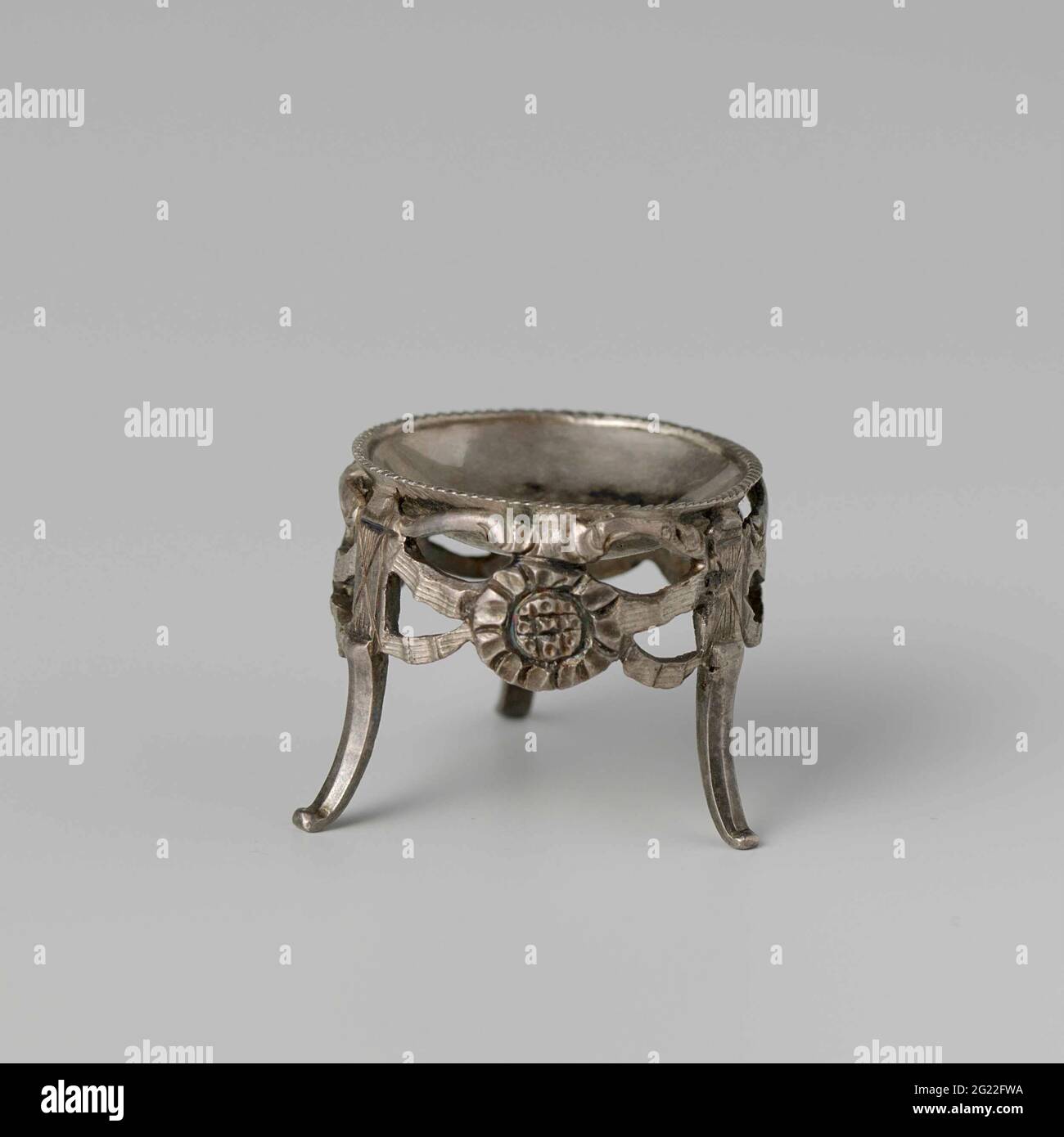 Salt barrel. Salt barrel on three outs of curved legs. Between the legs ...