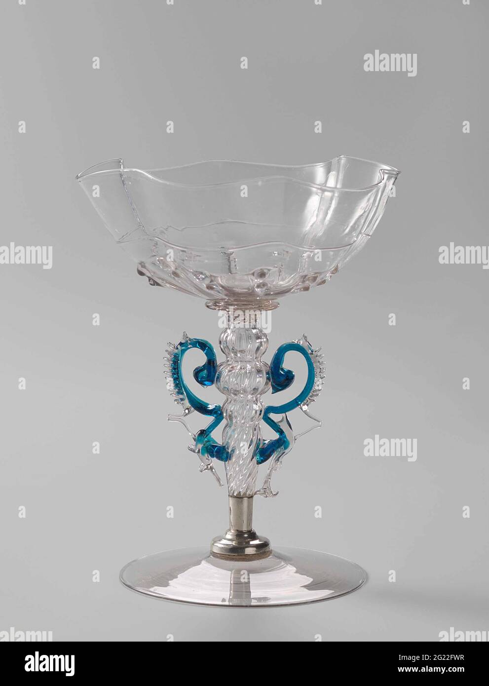 Wing glass with six-spectable chalice. Wing glass on flat foot. Hollow ...