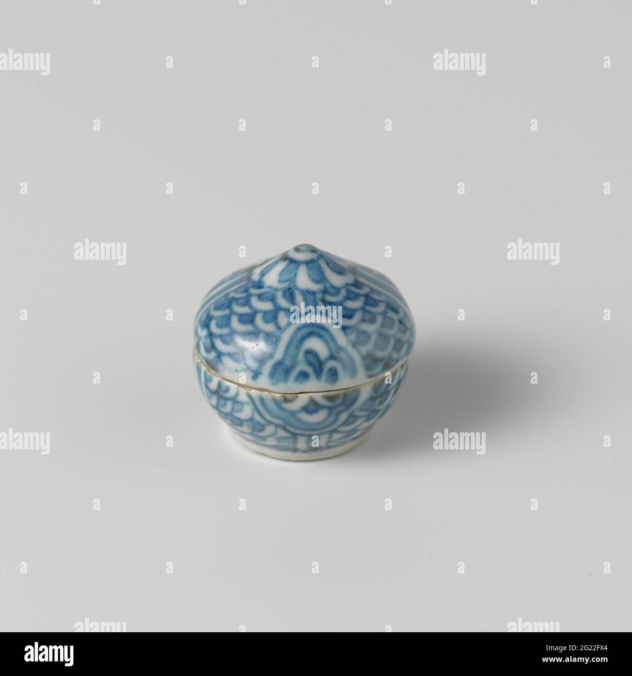 Round Box with a Wave Pattern and Blossoms. Round box of porcelain with ...