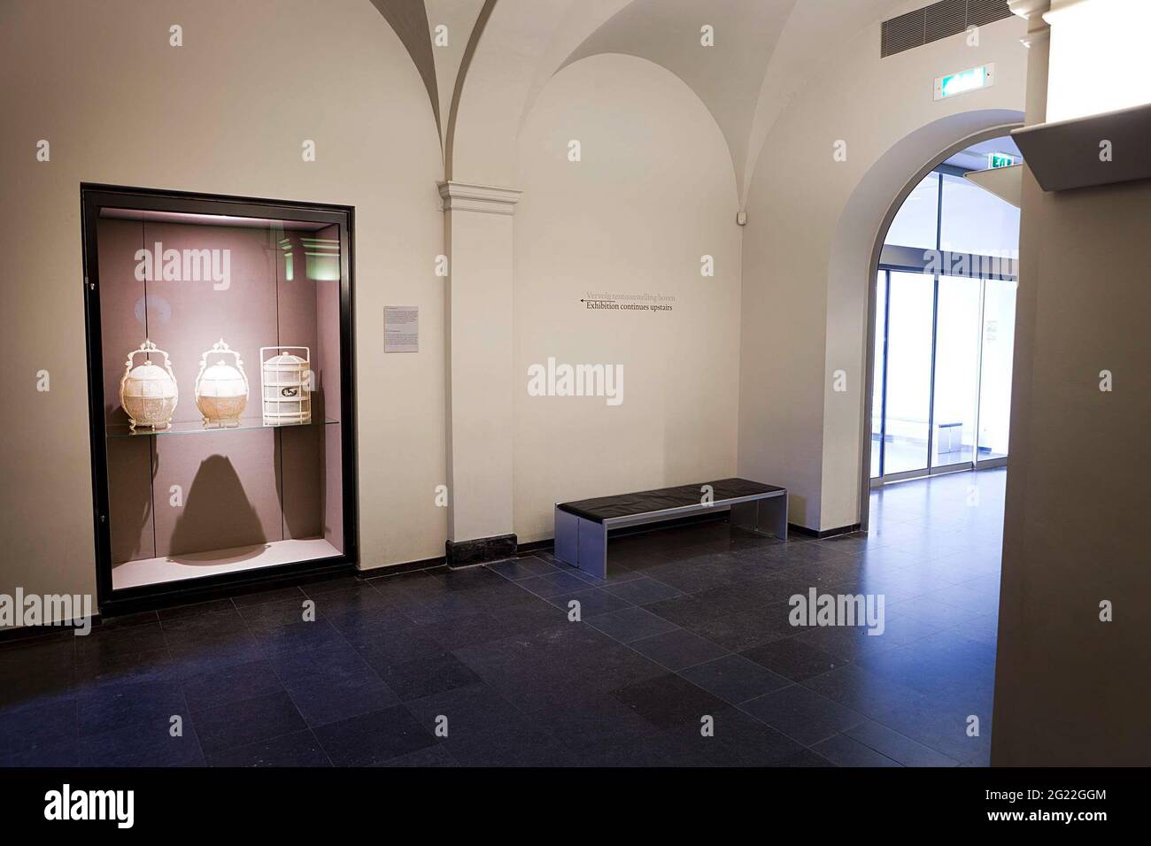 Space with vaulted ceiling and a built-in display case with three ivory ...