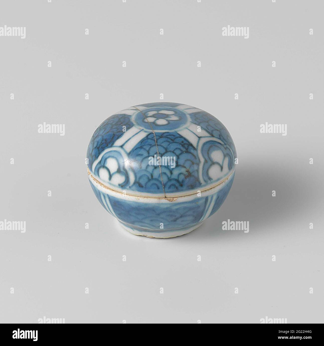 Round Box with a Wave Pattern and Blossoms. Round box of porcelain ...