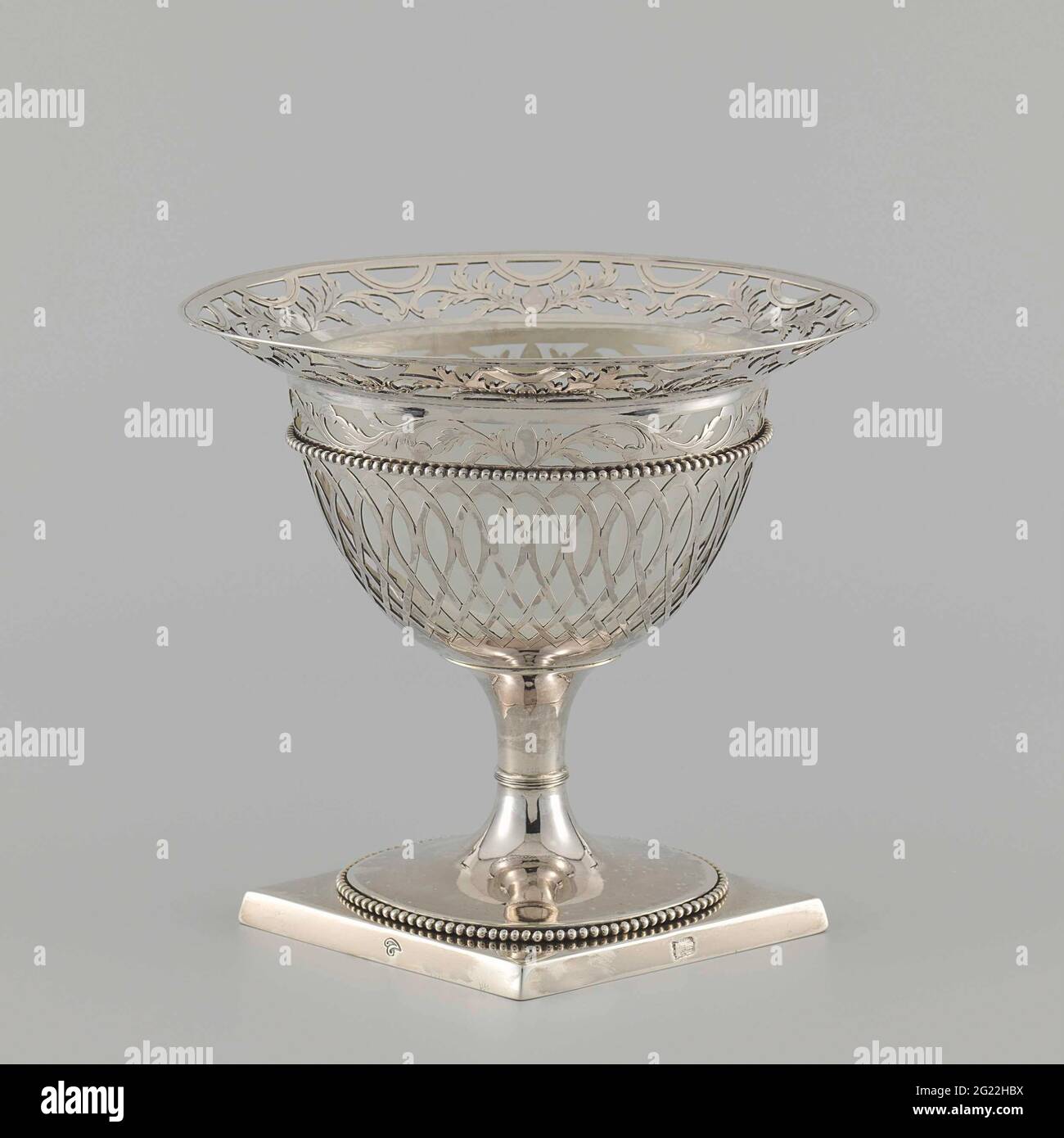 Spoon vase. Spoon vase of silver. The oval vase rests on a diamond ...