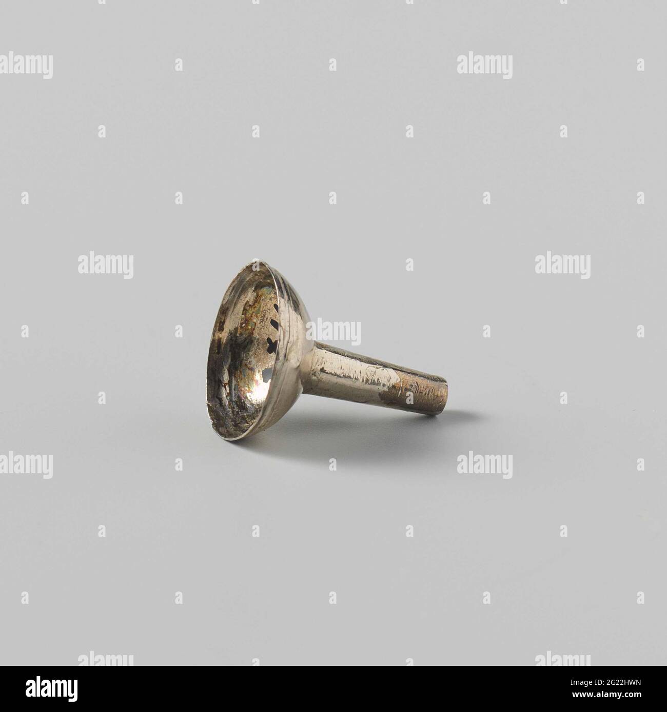 Funnel. Smooth, round funnel. Two lines have been engraved along the ...