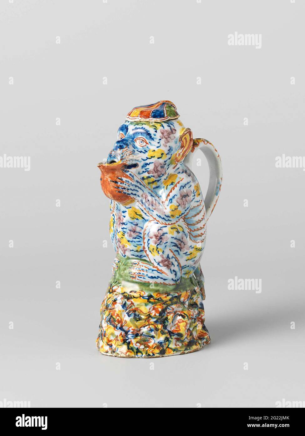 Milk jug in the form of a monkey from multicolored painted faïence ...