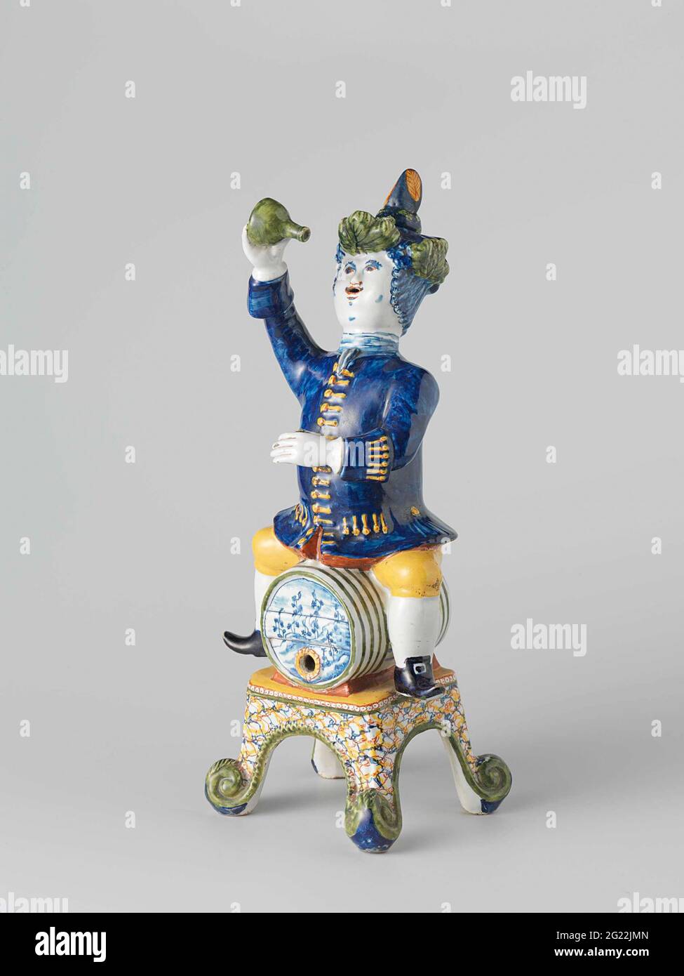 Decorative object: man with bottle in hand, on tub. Decorative object ...