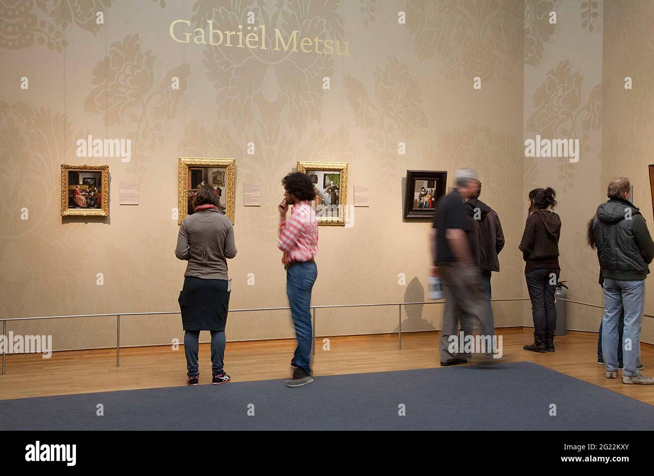 Standing visitors for a wall with four paintings; Exhibition: Gabriël ...