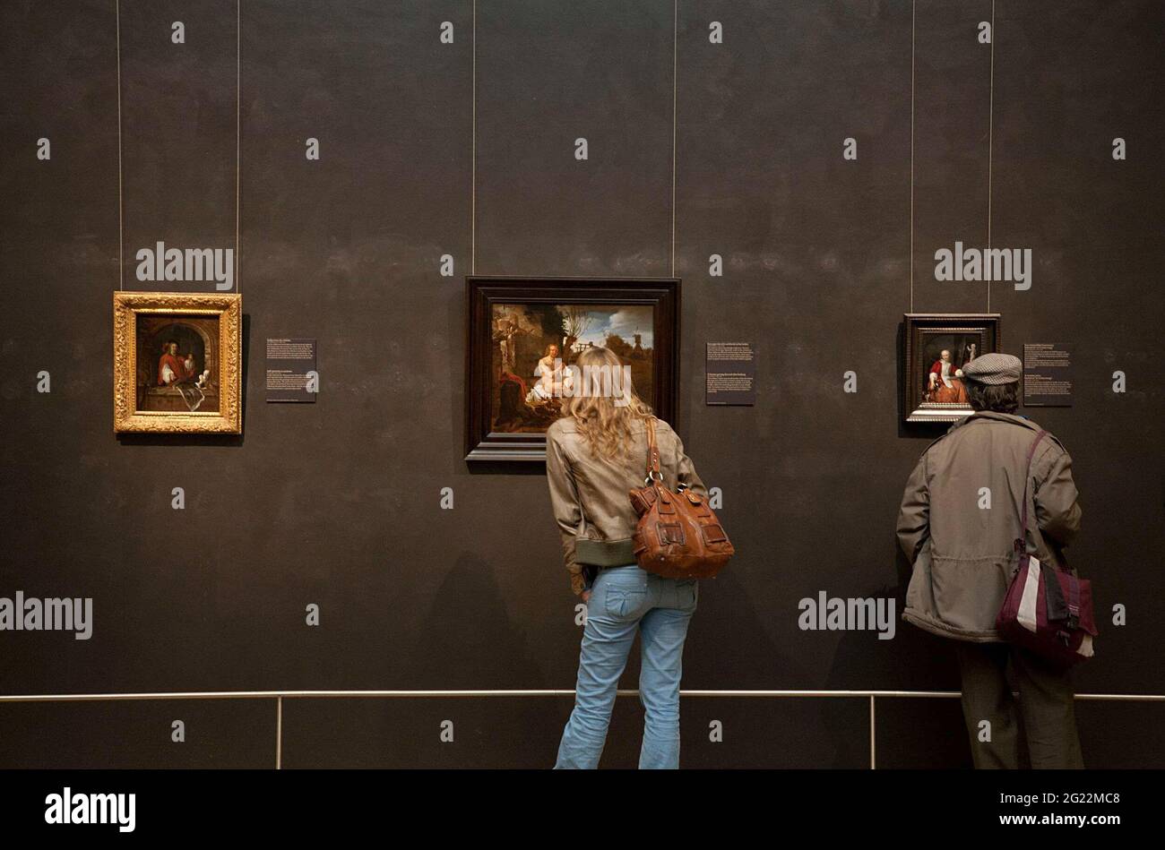Two visitors for a wall with three paintings; Exhibition: Gabriël Metsu ...