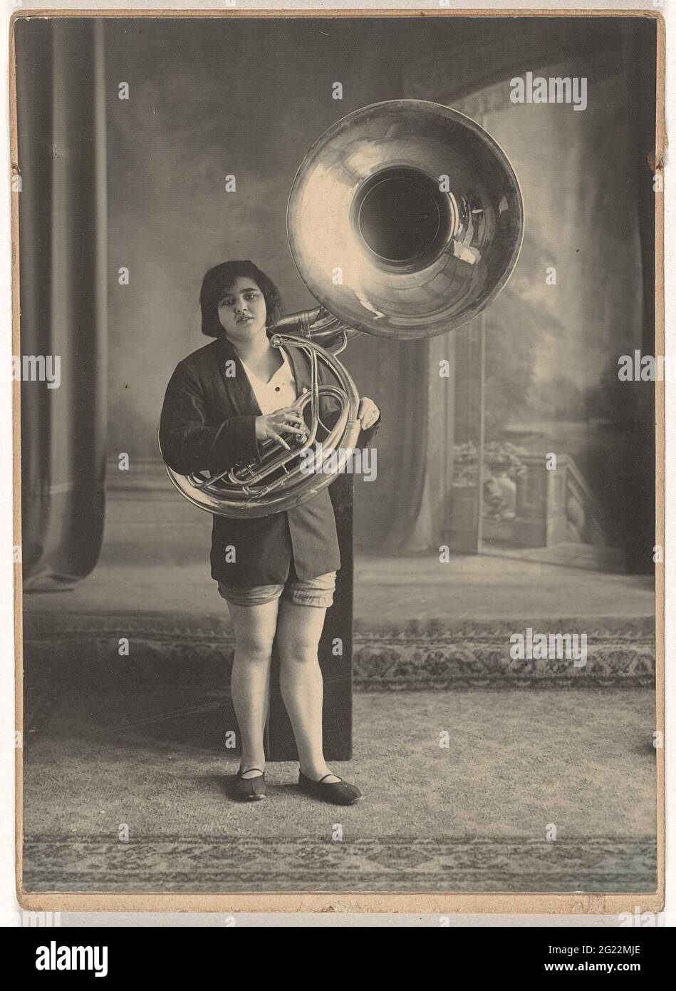 Portrait of a girl with tuba in a theater Stock Photo - Alamy
