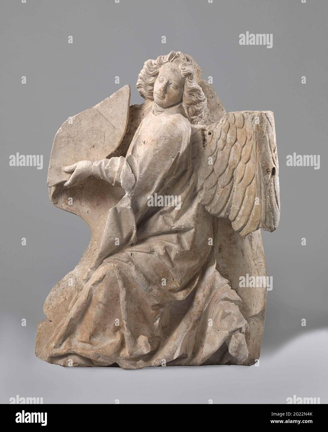 Kneeling angel (shield bearer Stock Photo - Alamy