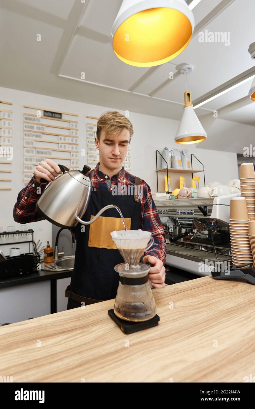 Man using coffee grinder hi-res stock photography and images - Alamy