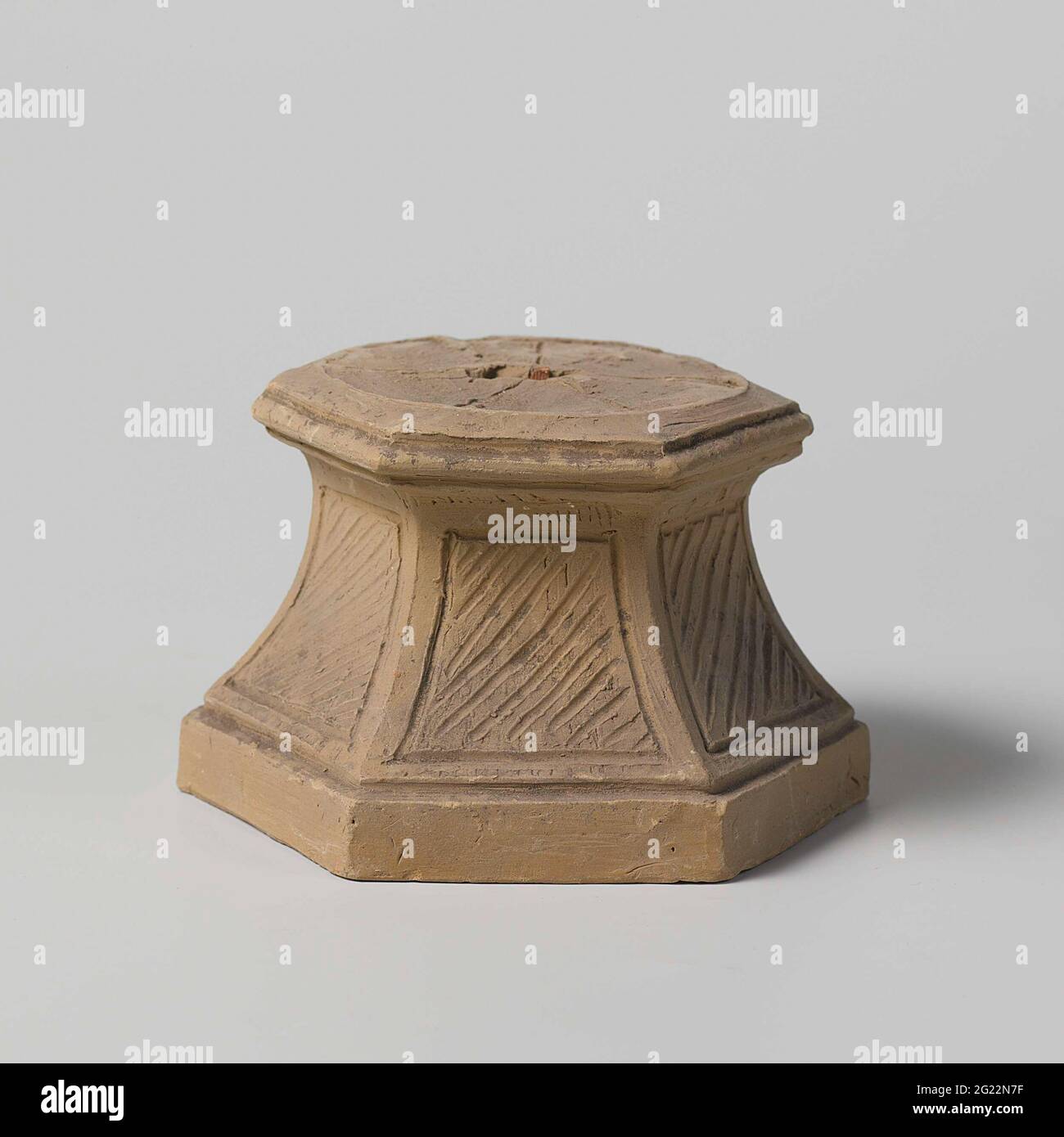 Hexagonal clay base, belonging to design for a floral standard ...