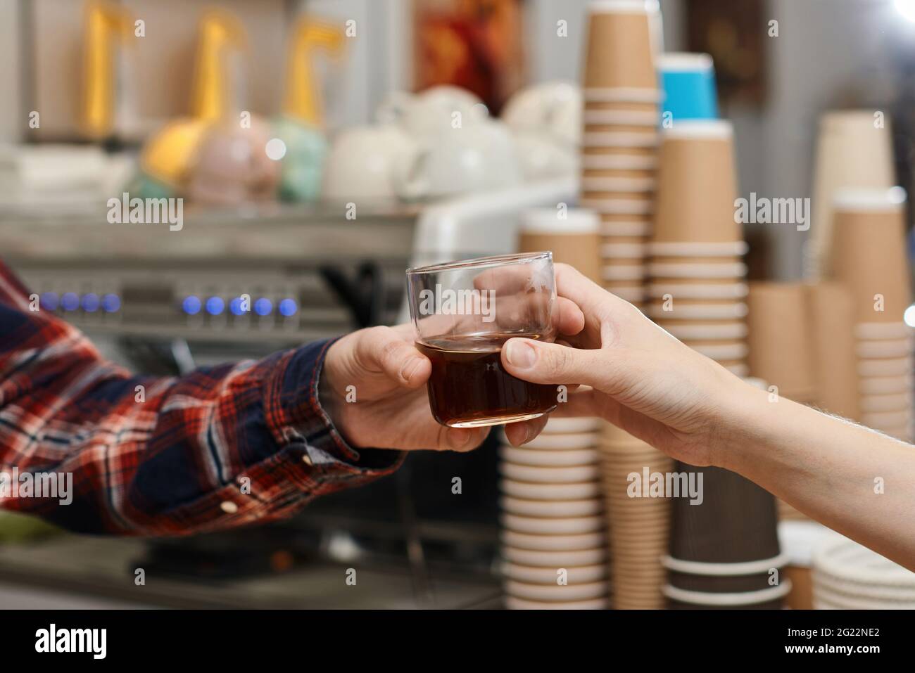 Male barista giving client hi-res stock photography and images - Alamy