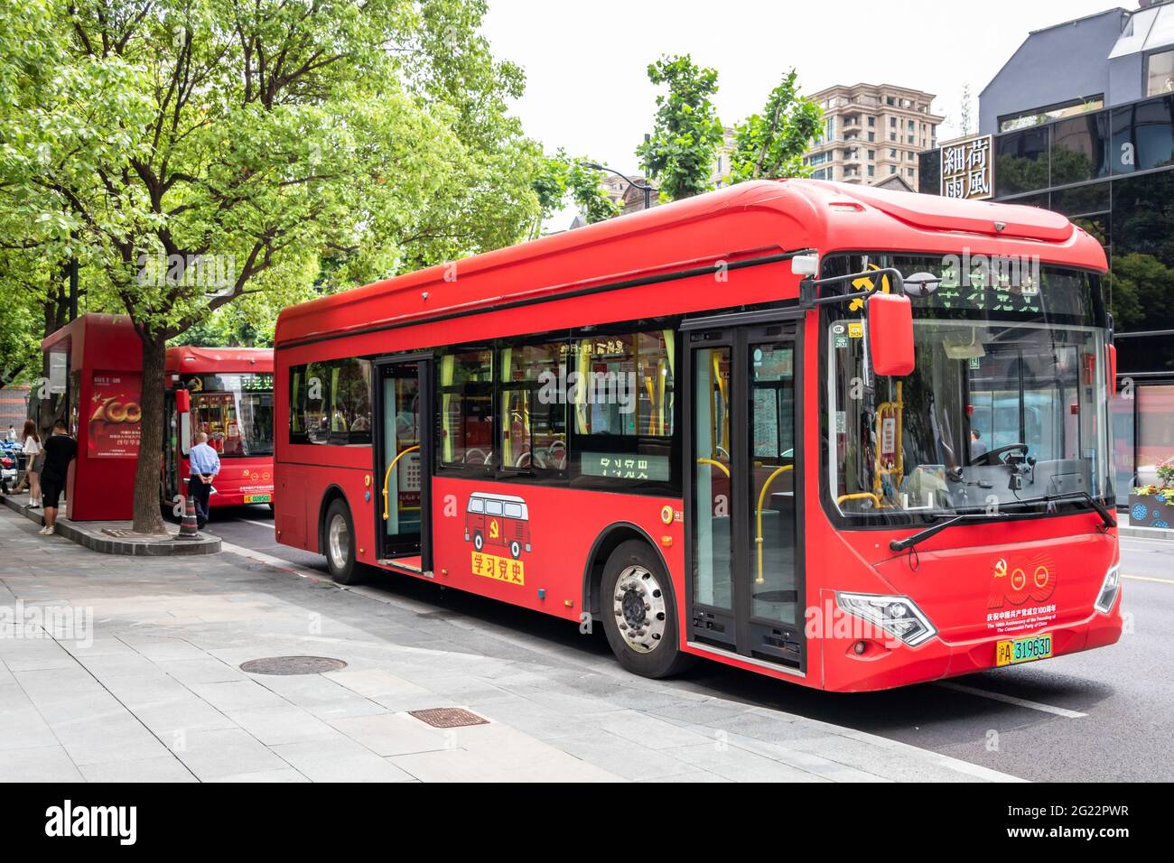 SHANGHAI, CHINA - JUNE 8, 2021 - A red party history bus stops at the ...