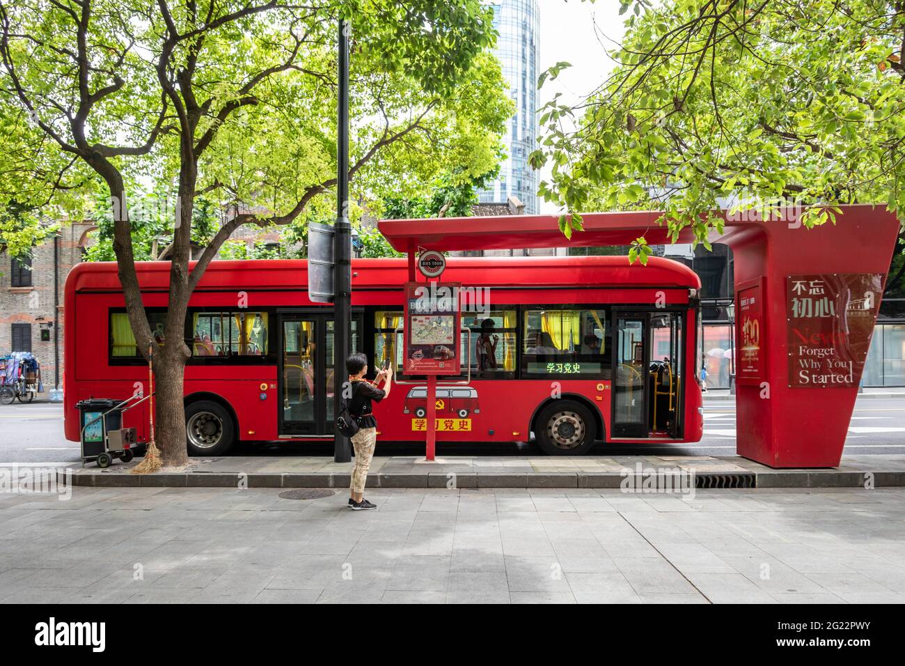 SHANGHAI, CHINA - JUNE 8, 2021 - A red party history bus stops at the ...