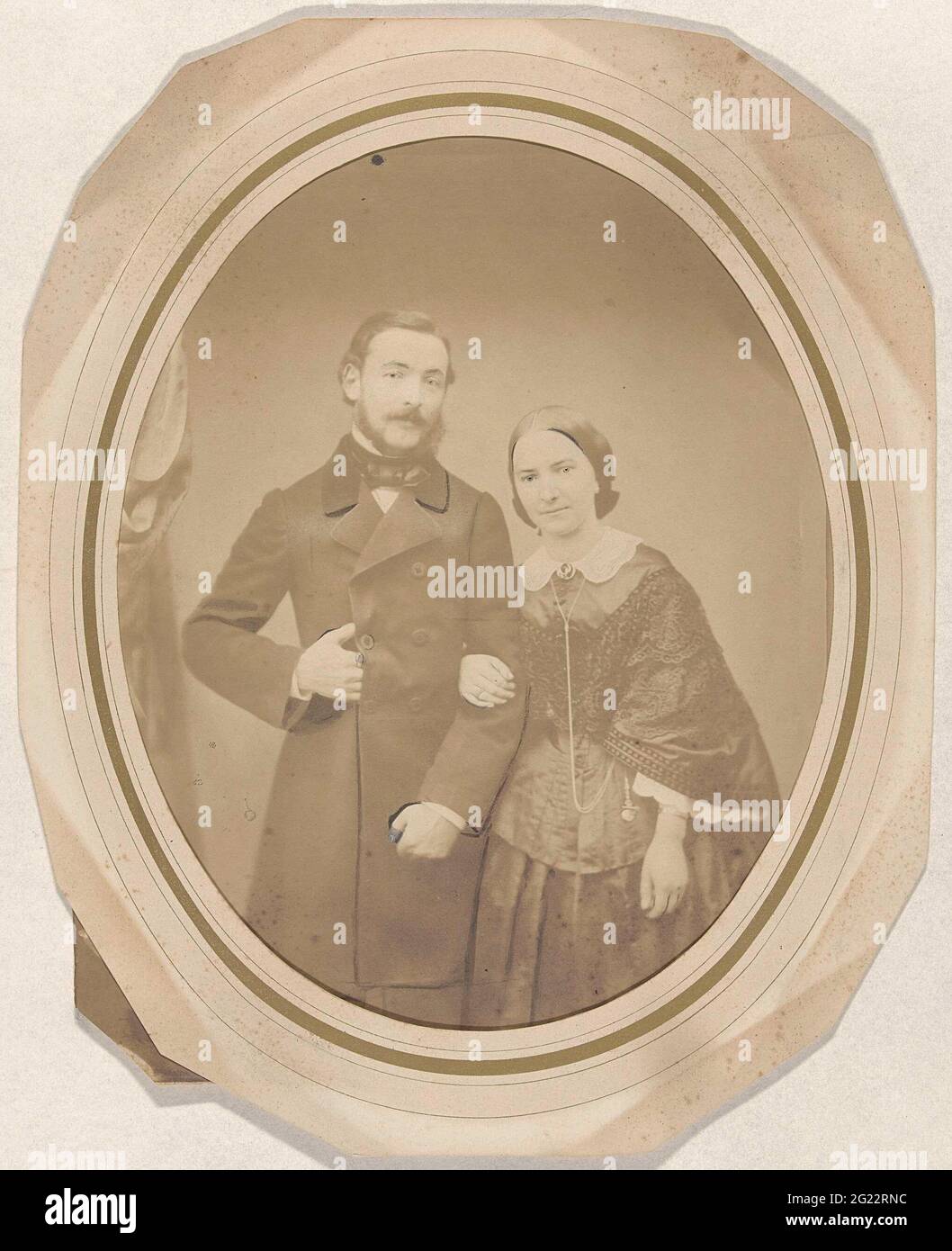 Studio portrait of a man and woman standing Stock Photo - Alamy