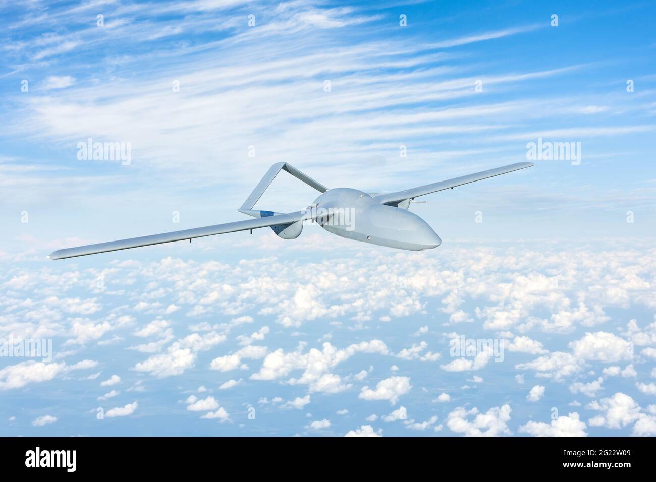 Unmanned aerial vehicle flying high in the sky above the clouds ...