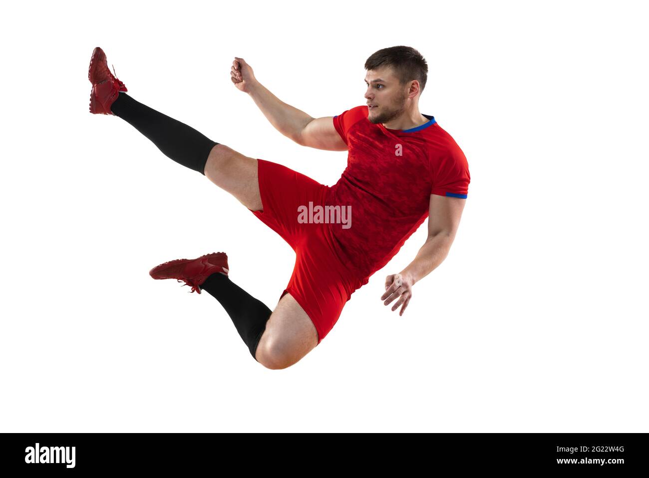 Powerful, flying above the field. Young football, soccer player in ...