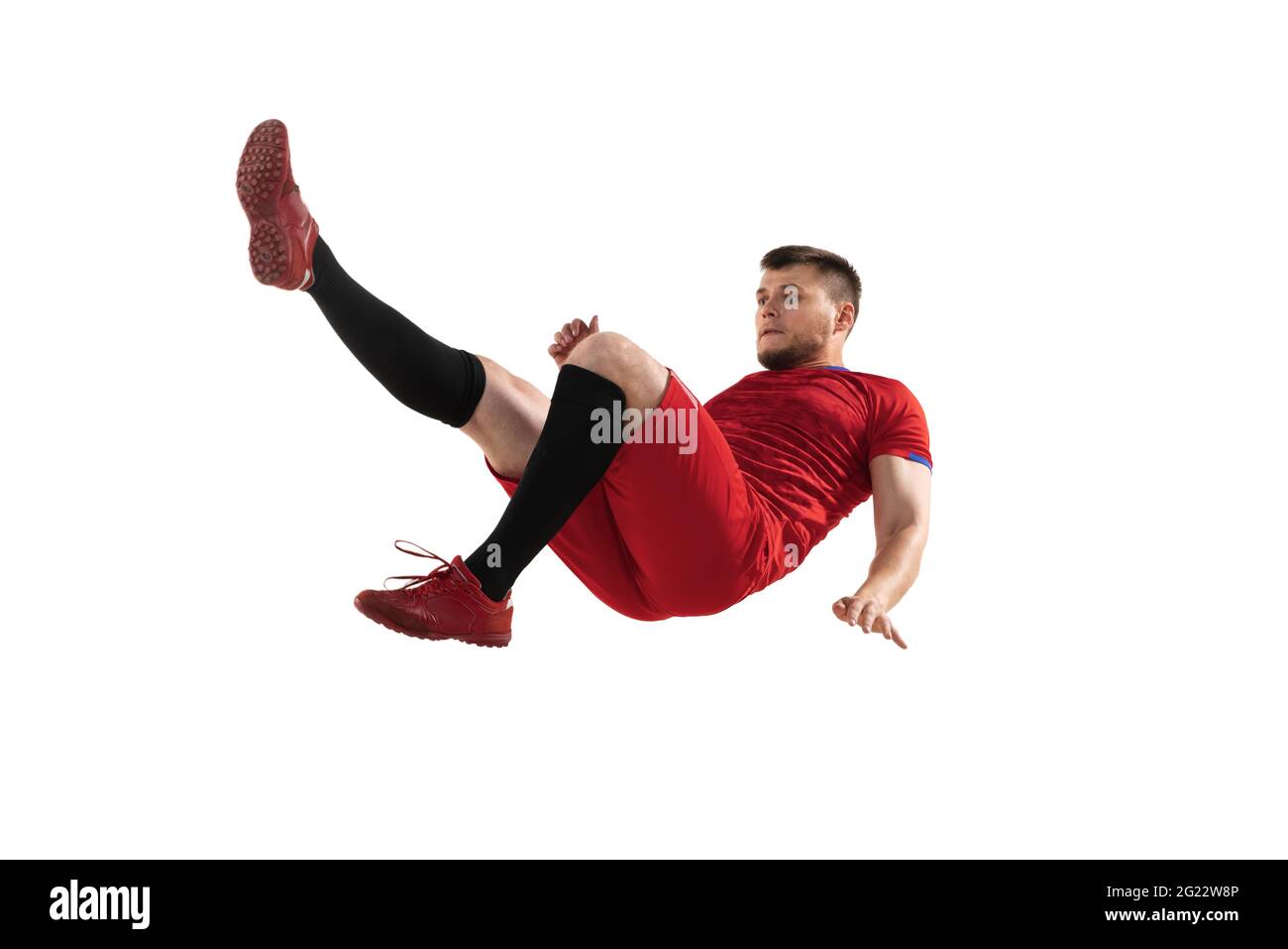 Powerful, flying above the field. Young football, soccer player in ...