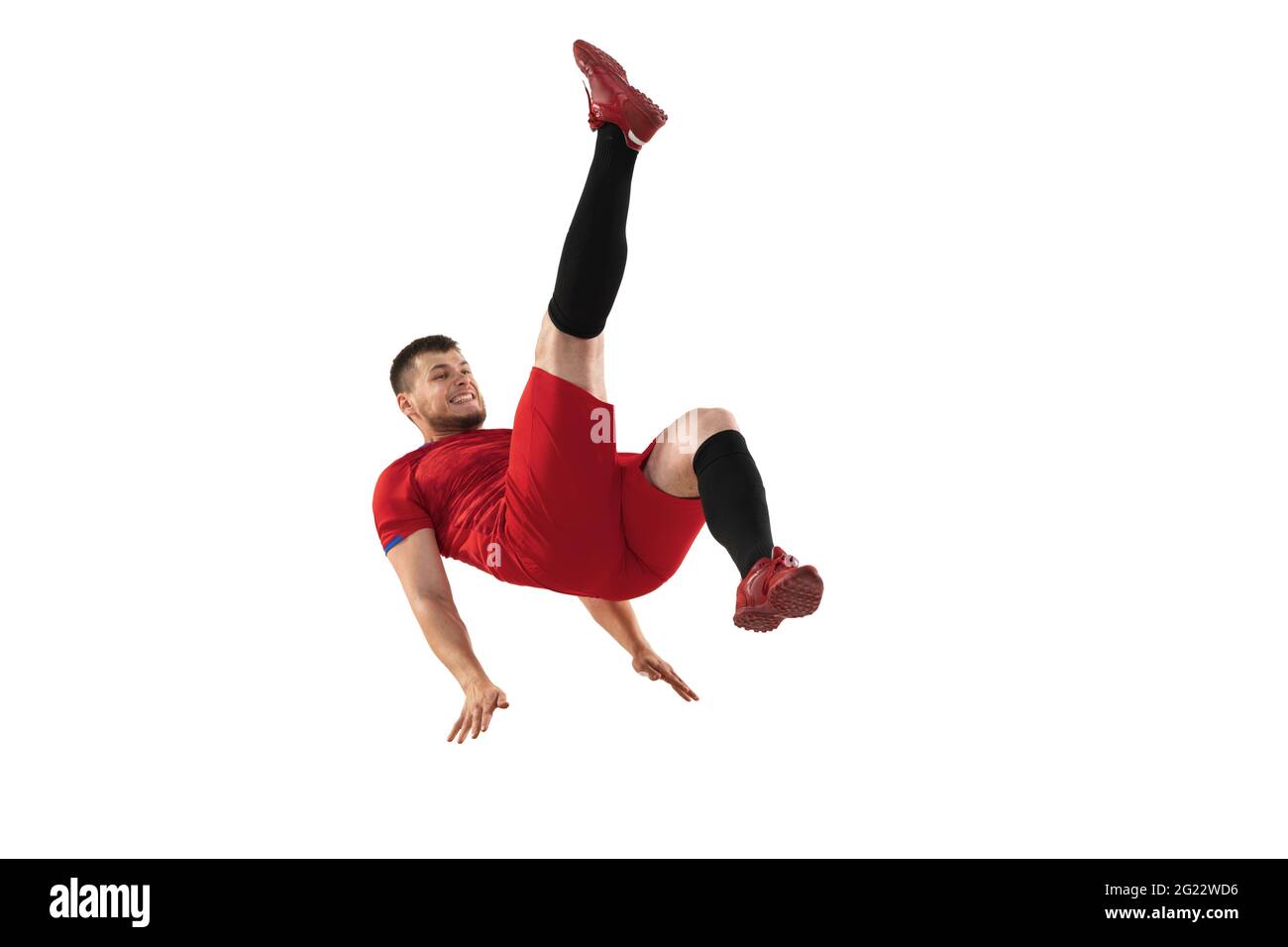 Powerful, flying above the field. Young football, soccer player in ...
