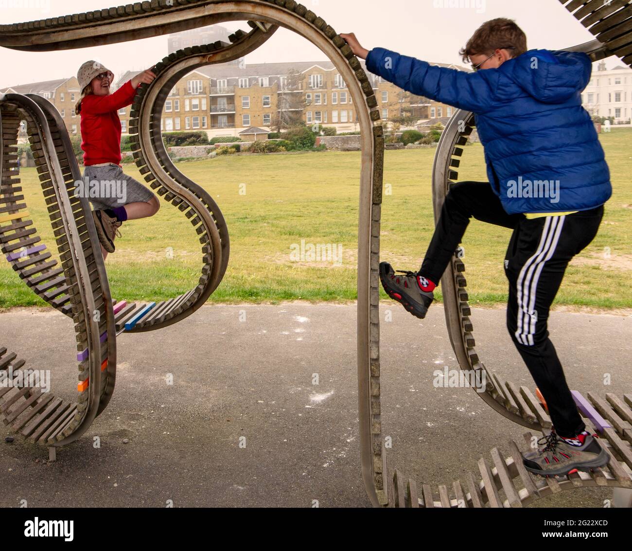 Children playing on climbing frame or sculptural bench (the longest ...
