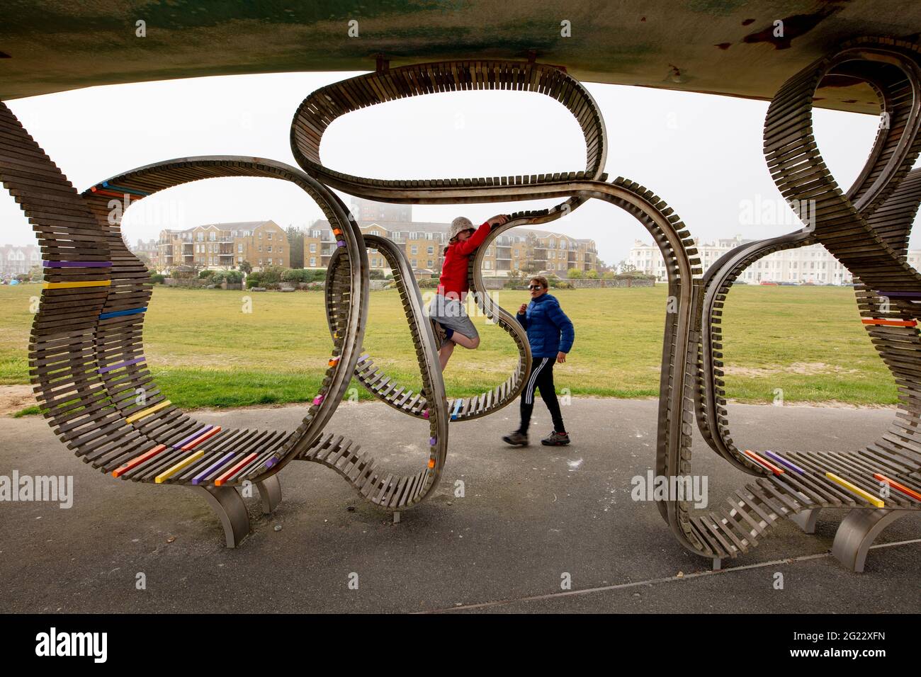 Children playing on climbing frame or sculptural bench (the longest ...