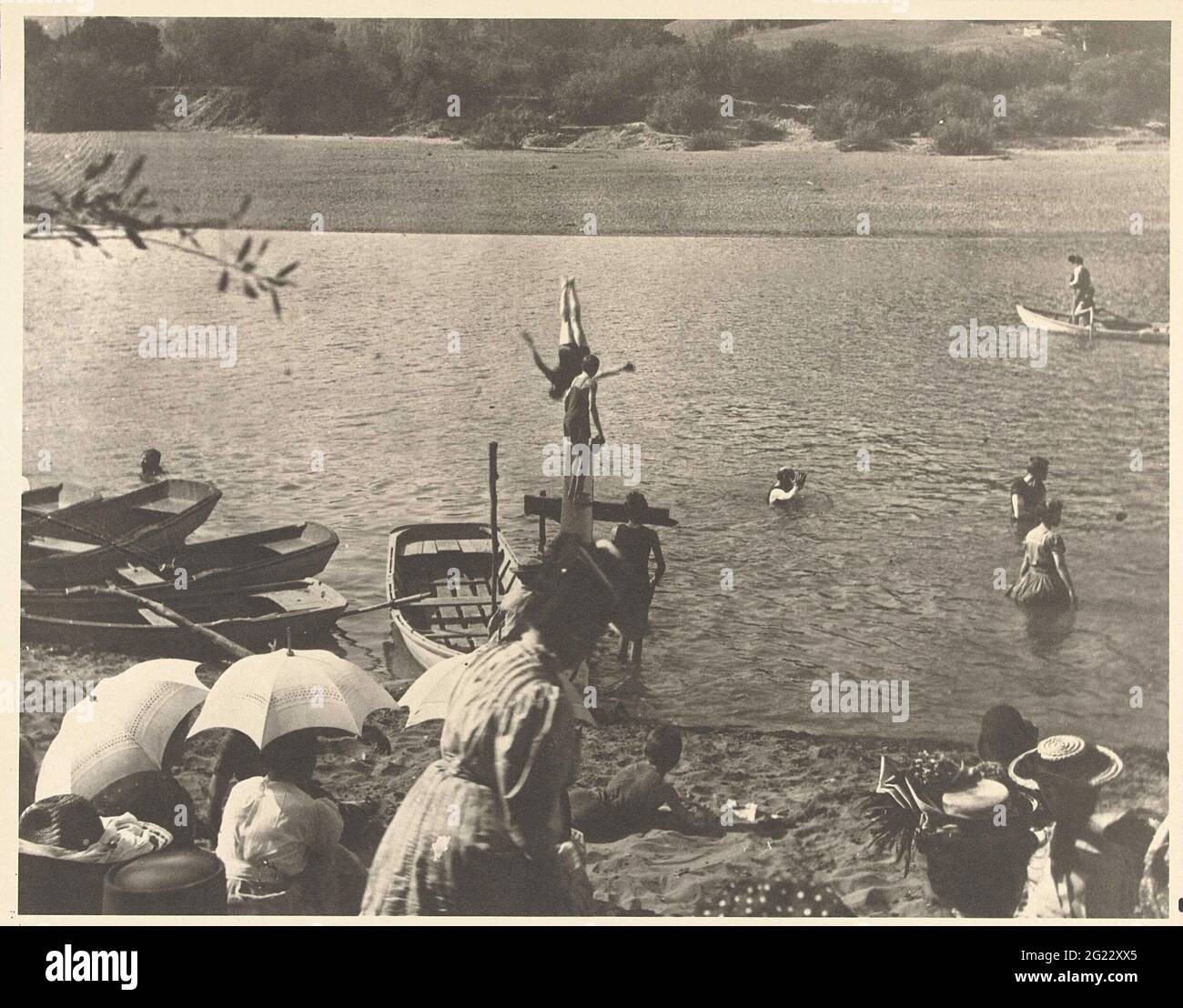 People bathe and sunbathe in a river; Diving at the Russian River, 1907 ...