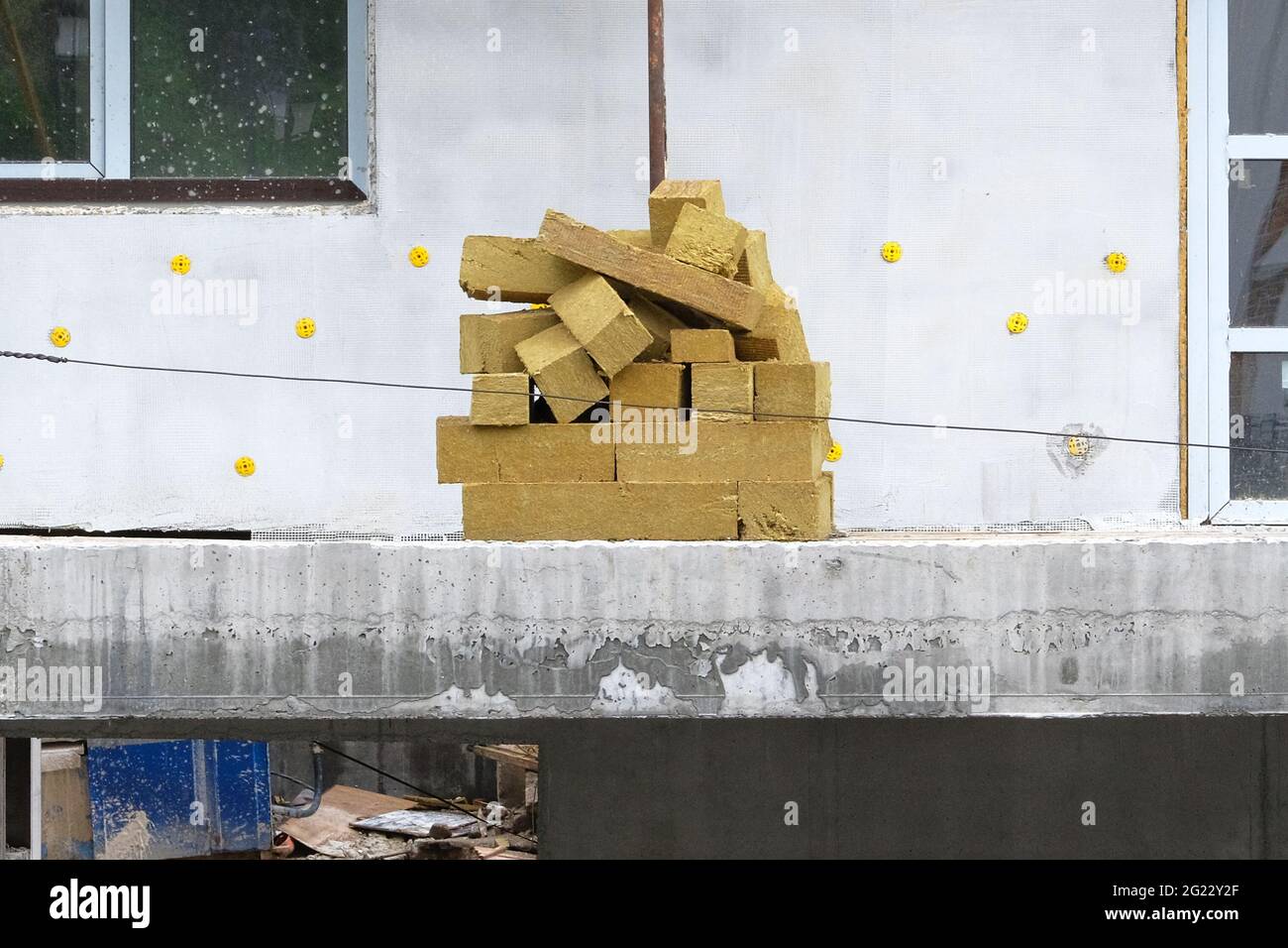 Mineral wool for insulated house. Stack of yellow mineral wool or ...