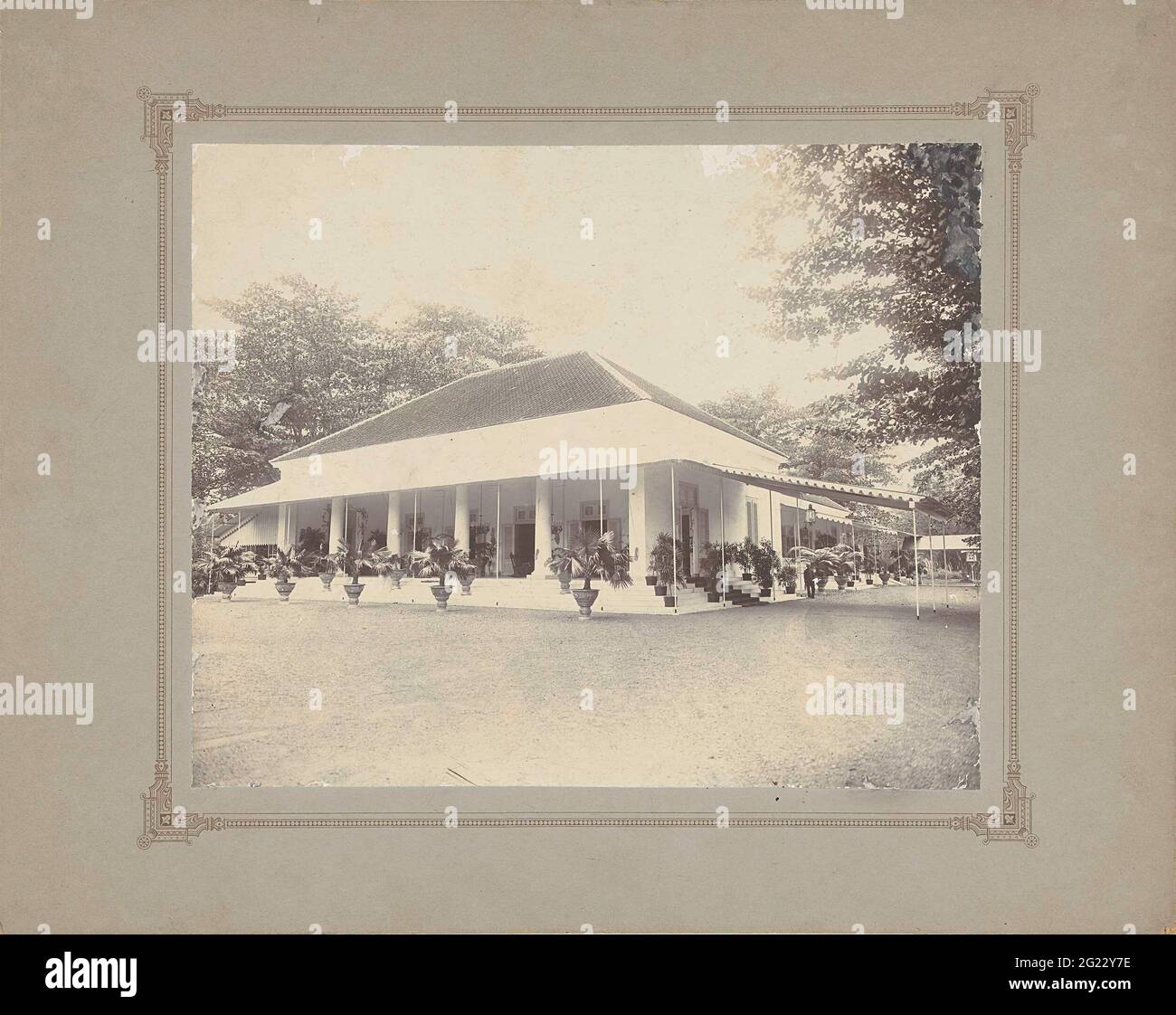 Villa with veranda and palms in Indonesia Stock Photo - Alamy