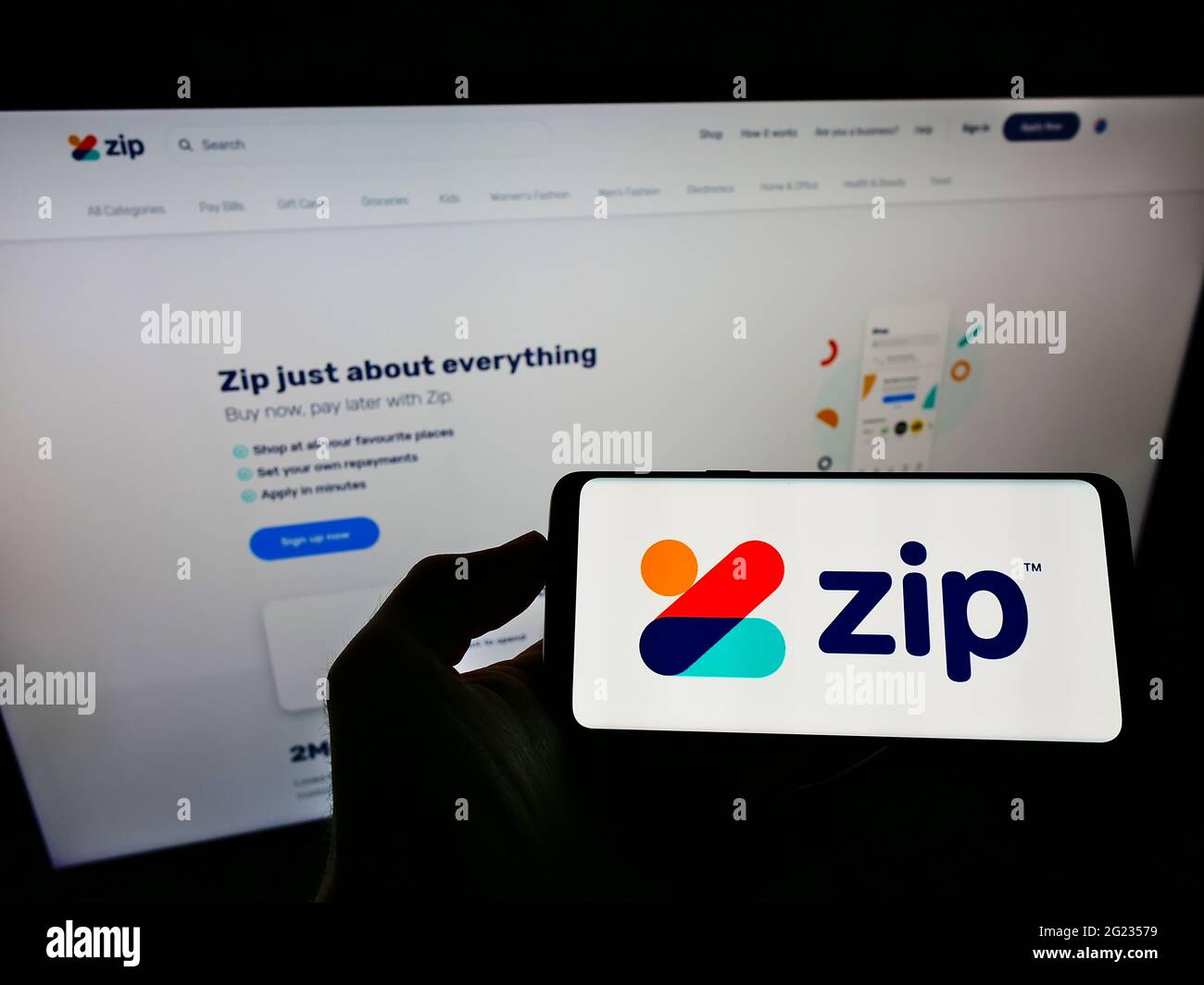 Person holding mobile phone with logo of Australian fintech company Zip ...
