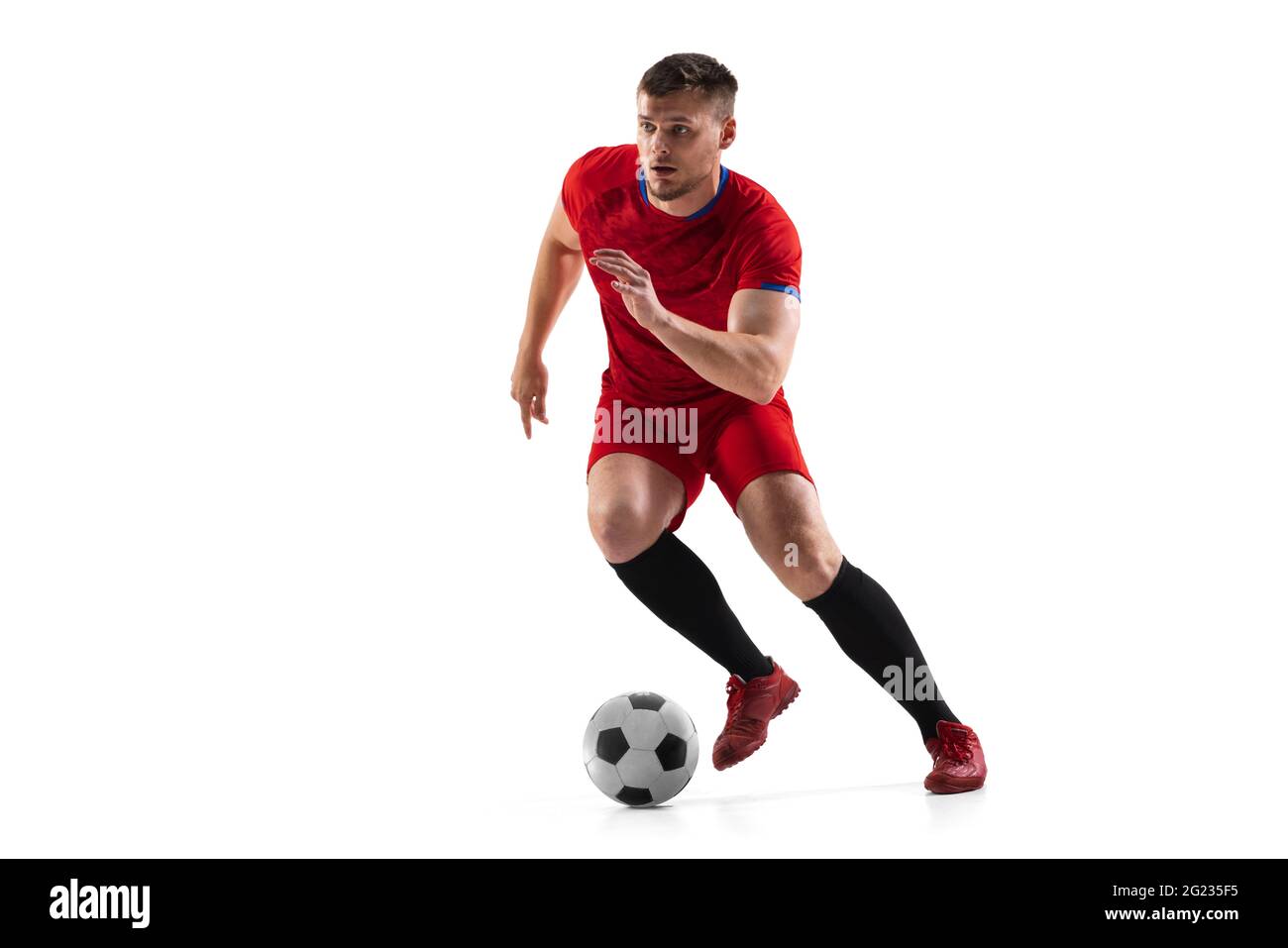 Powerful, flying above the field. Young football, soccer player in ...