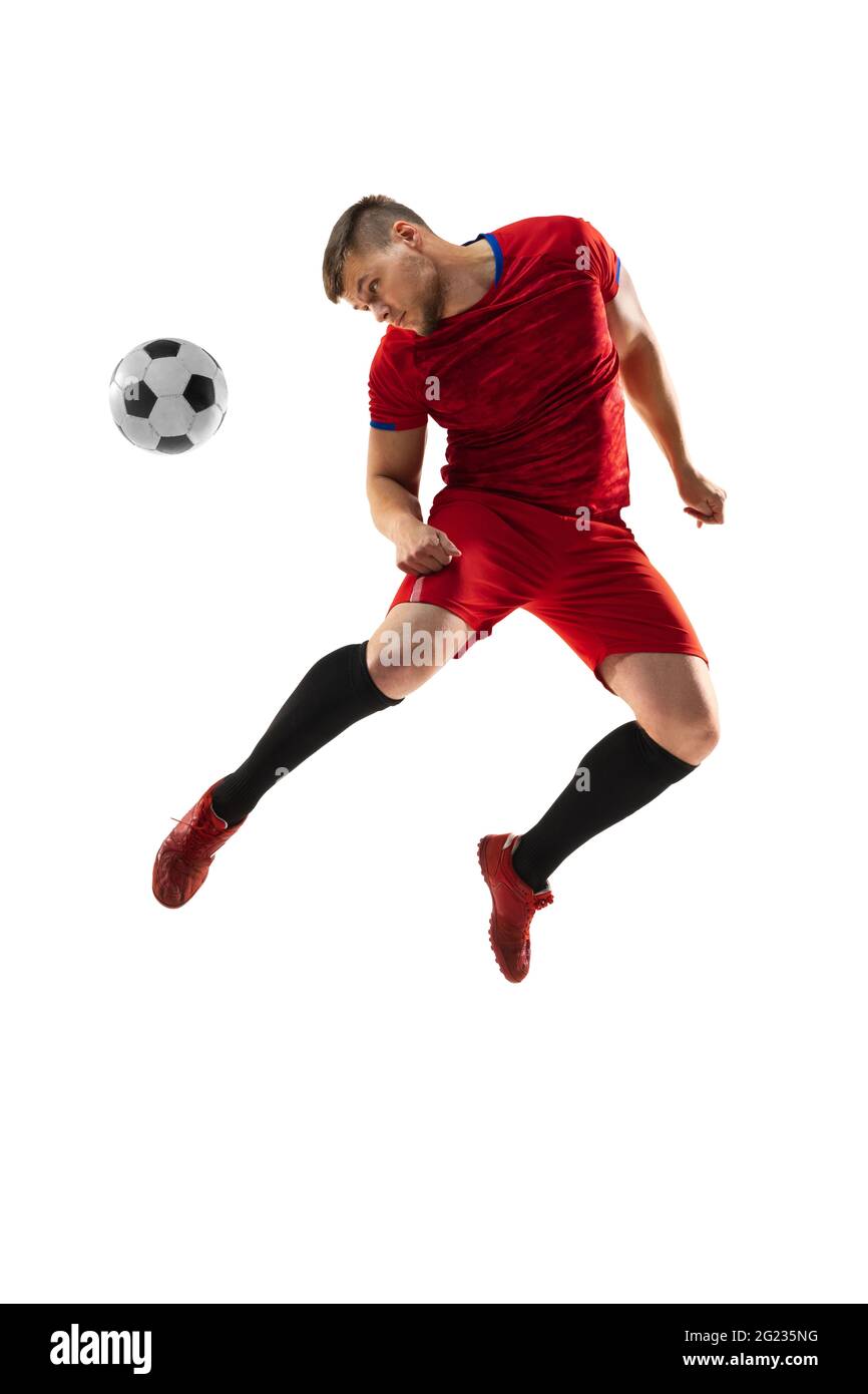 Powerful, flying above the field. Young football, soccer player in ...