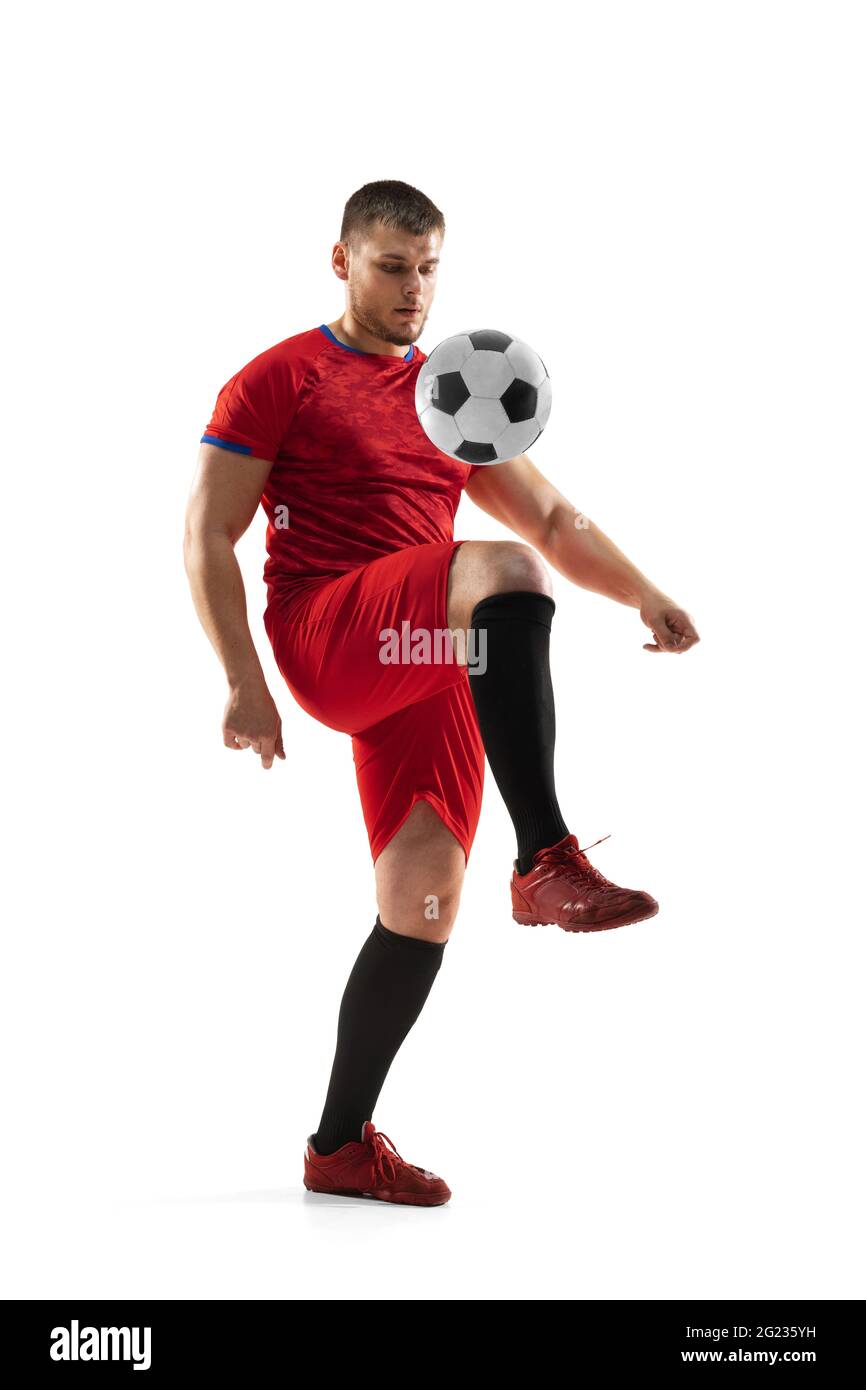 Powerful, flying above the field. Young football, soccer player in ...