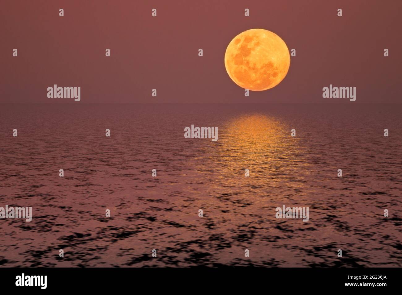 Full moon over water with reflection Stock Photo - Alamy