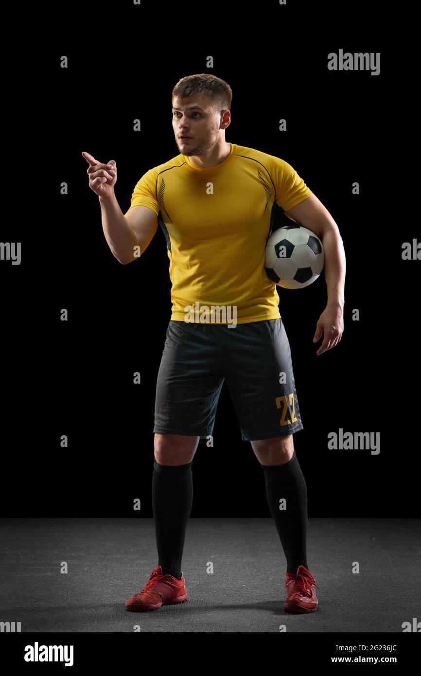 The male unhappy soccer or football player arguing with a judge. The ...