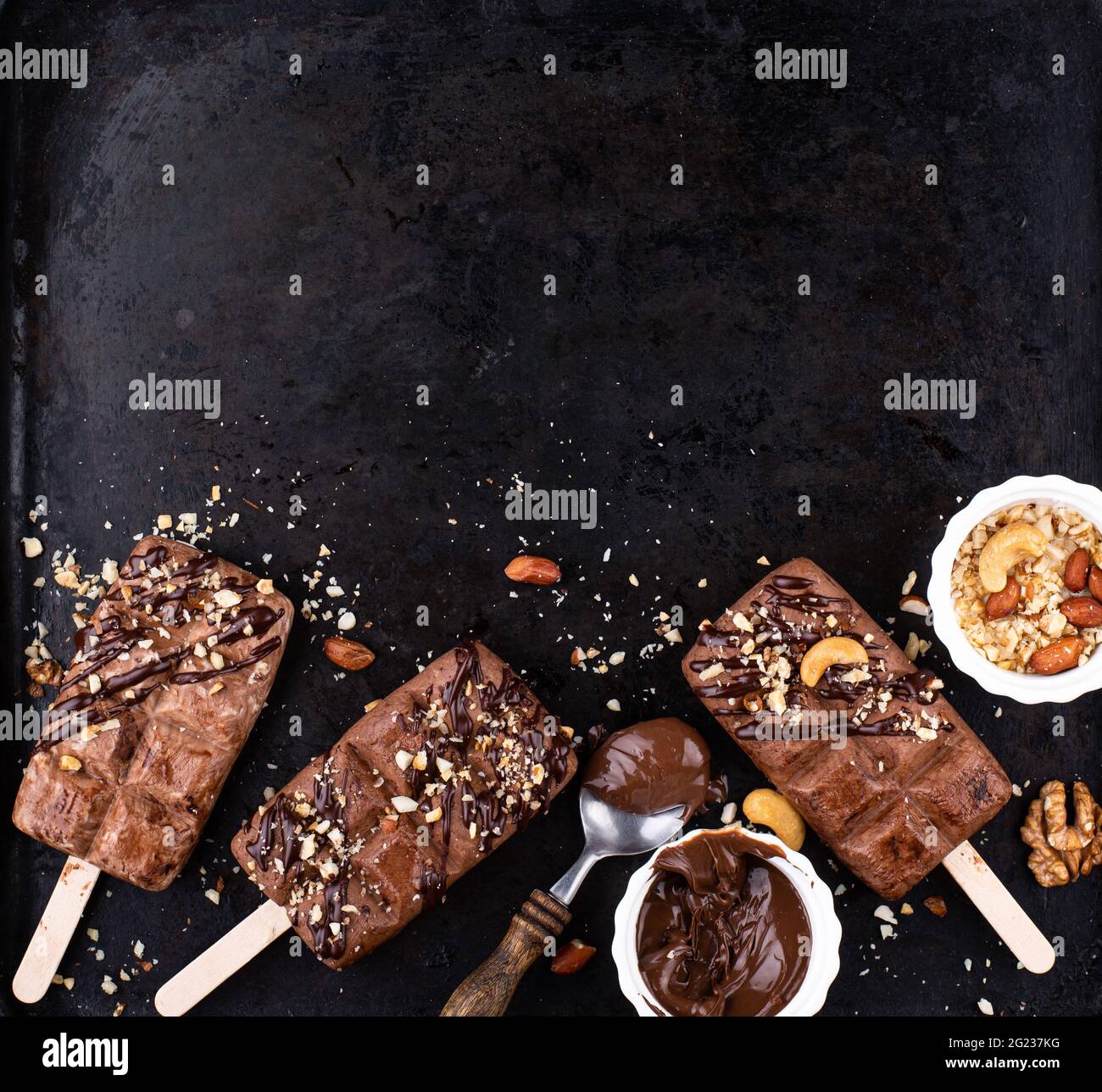 Chocolate ice cream popsicle with nuts Stock Photo - Alamy