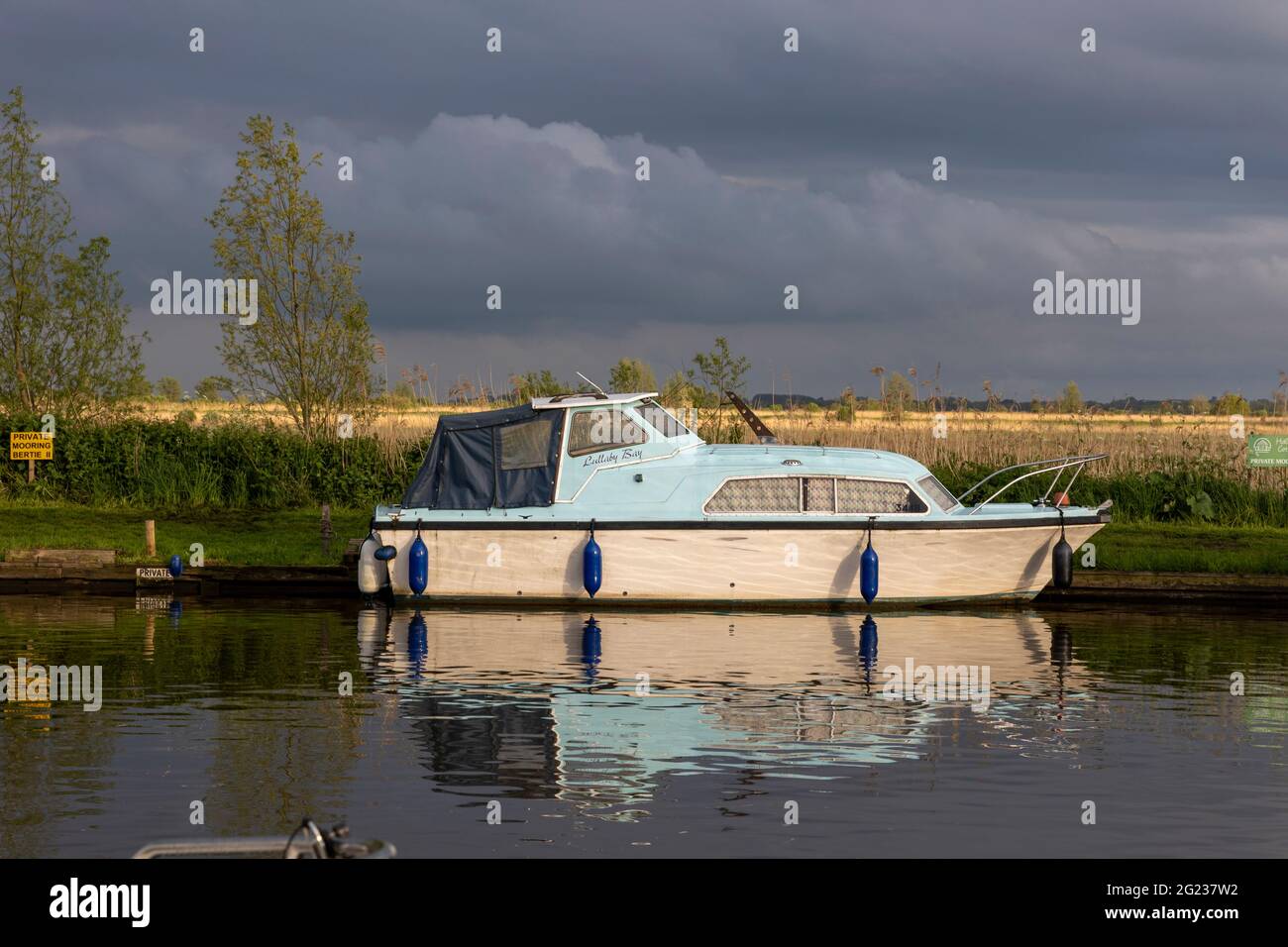 Moored boats and cabin cruises on the River Ant at Ludham bridge ...