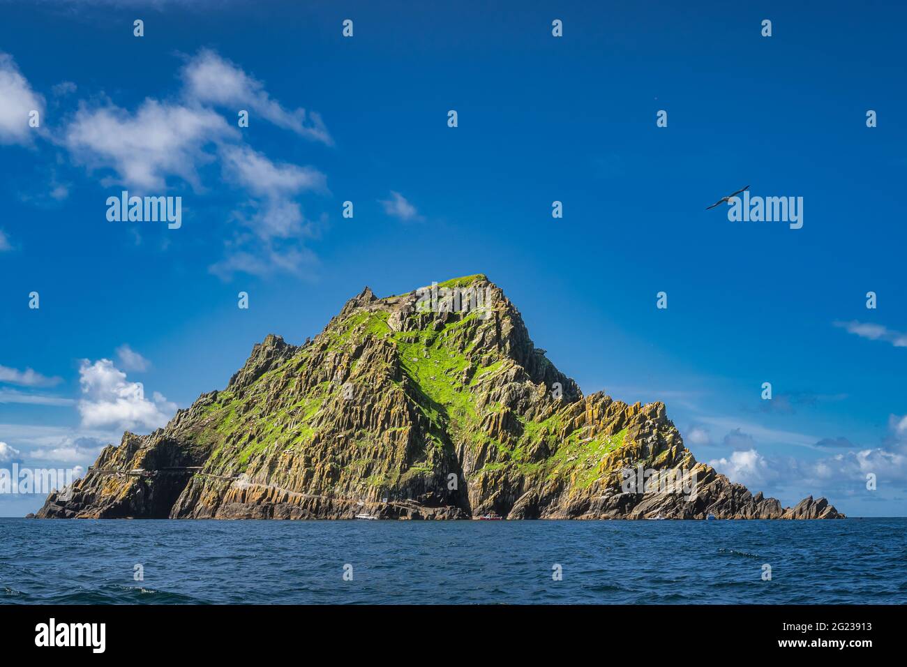 Tour boats docking to Skellig Michael island with monks hermitage on ...