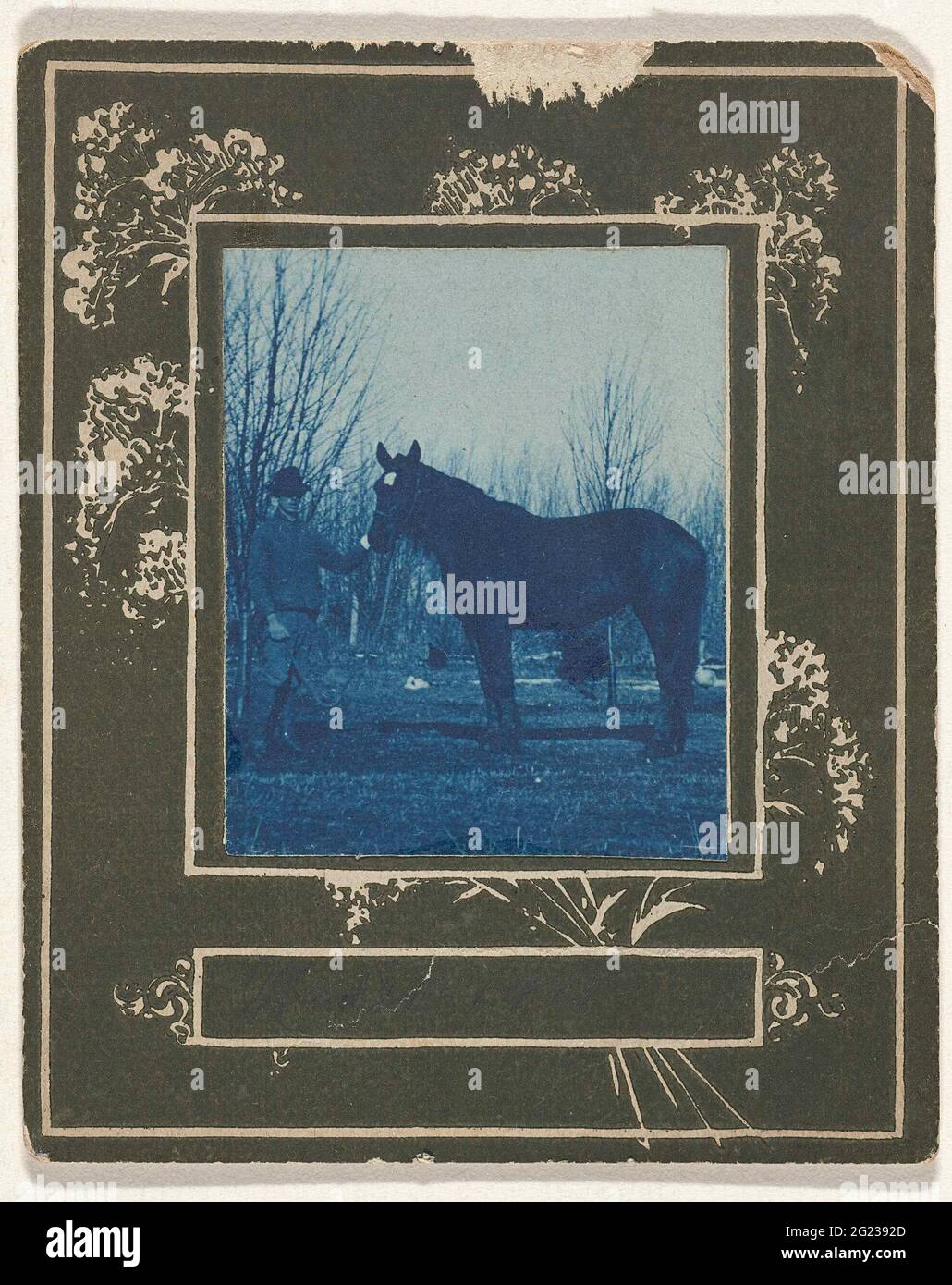 Man standing at the horse cap Stock Photo - Alamy