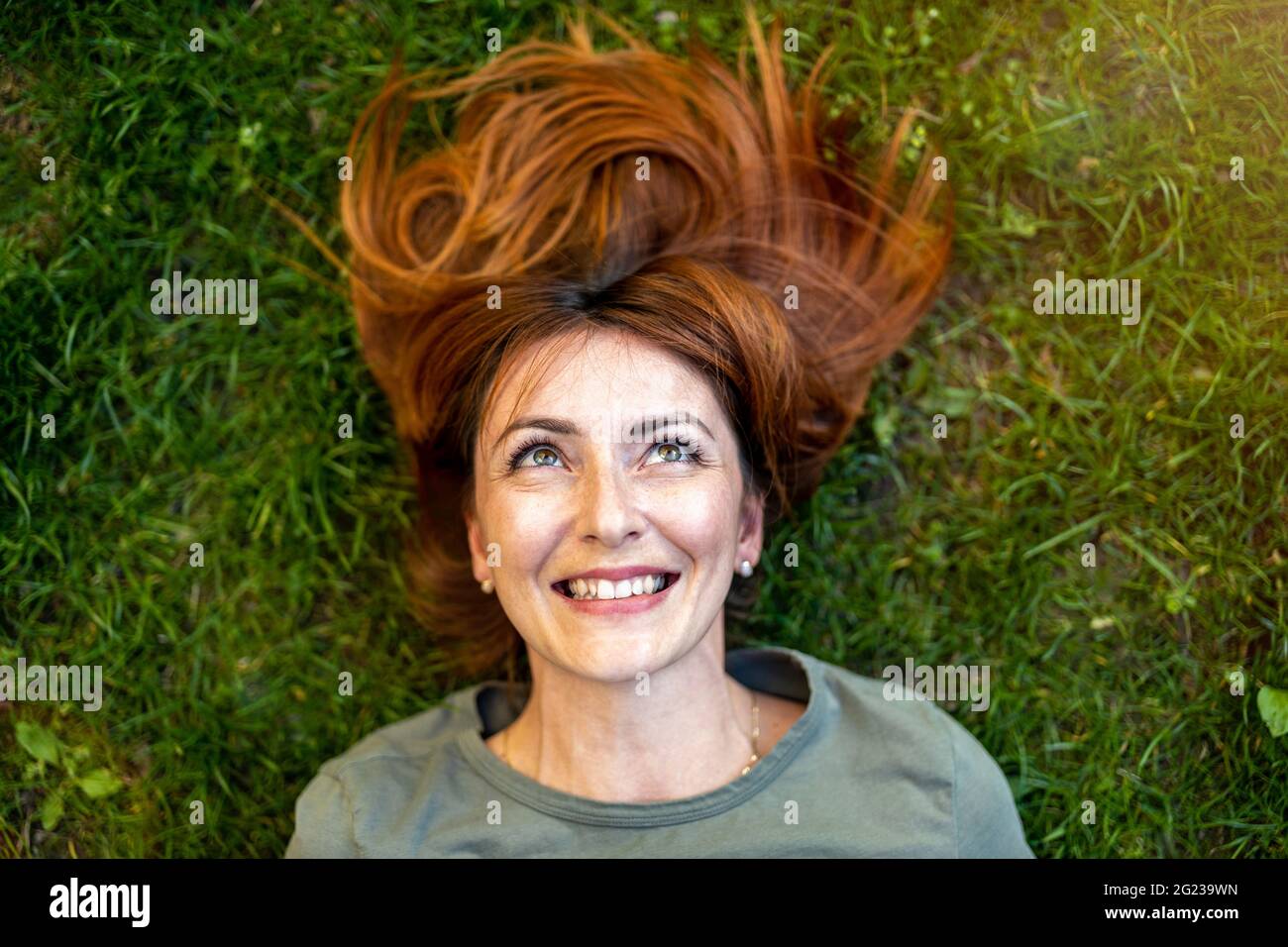 Woman lying in the sun hi-res stock photography and images - Alamy