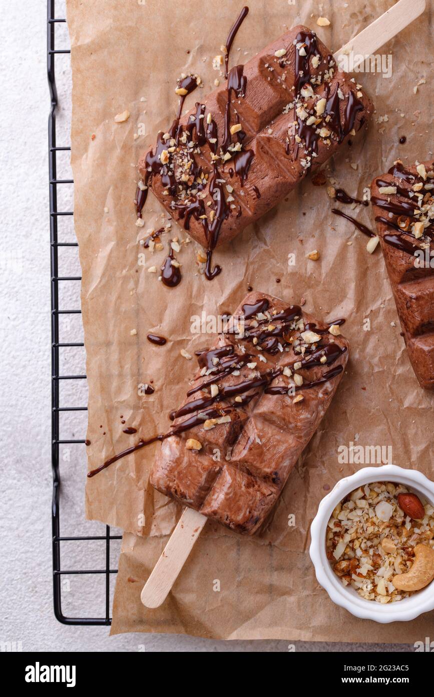 Chocolate ice cream popsicle with nut Stock Photo - Alamy
