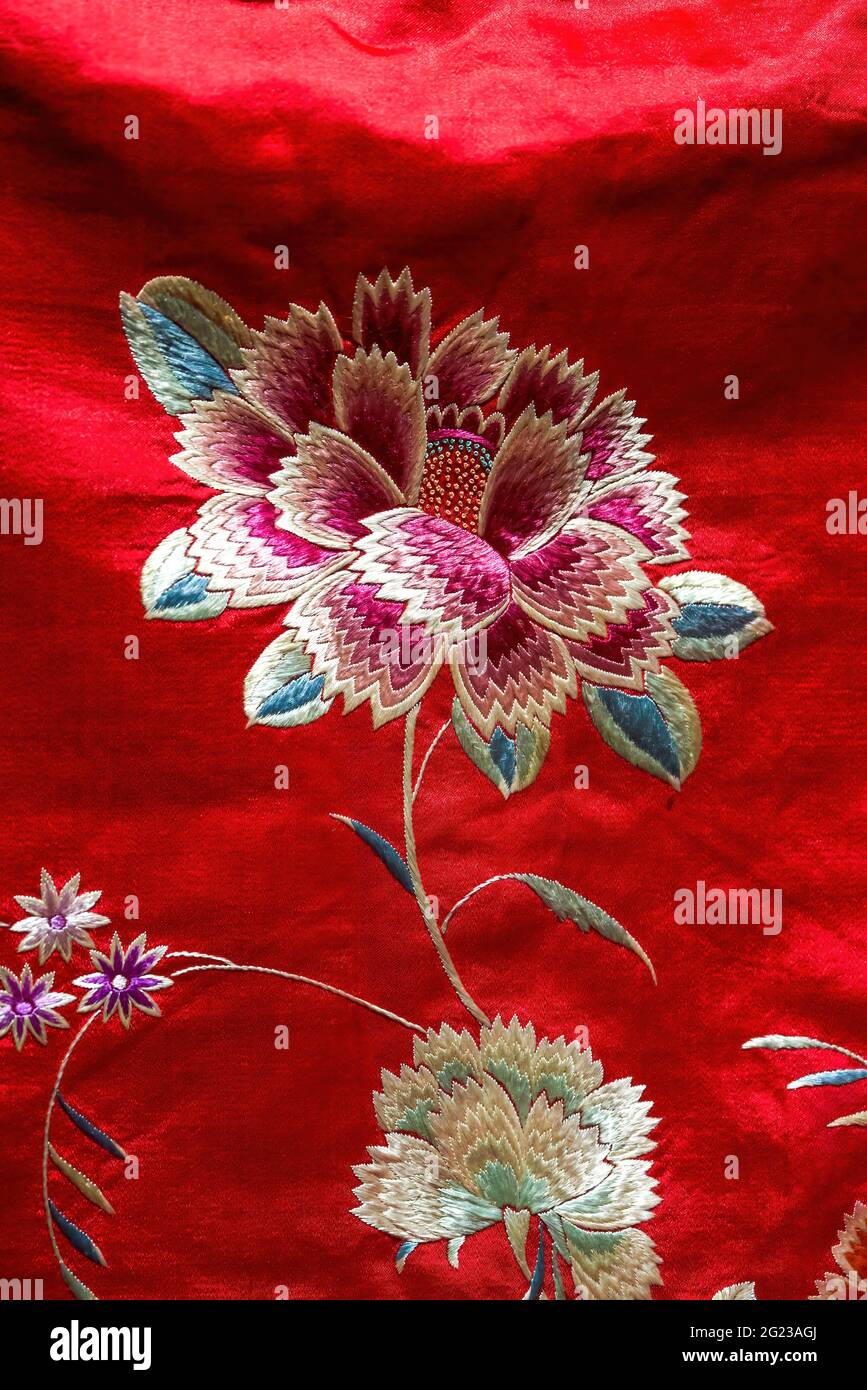 Flower Embroidery Closeup On Traditional Chinese Silk Clothes Stock flower-embroidery-closeup-on-traditional-chinese-silk-clothes-stock