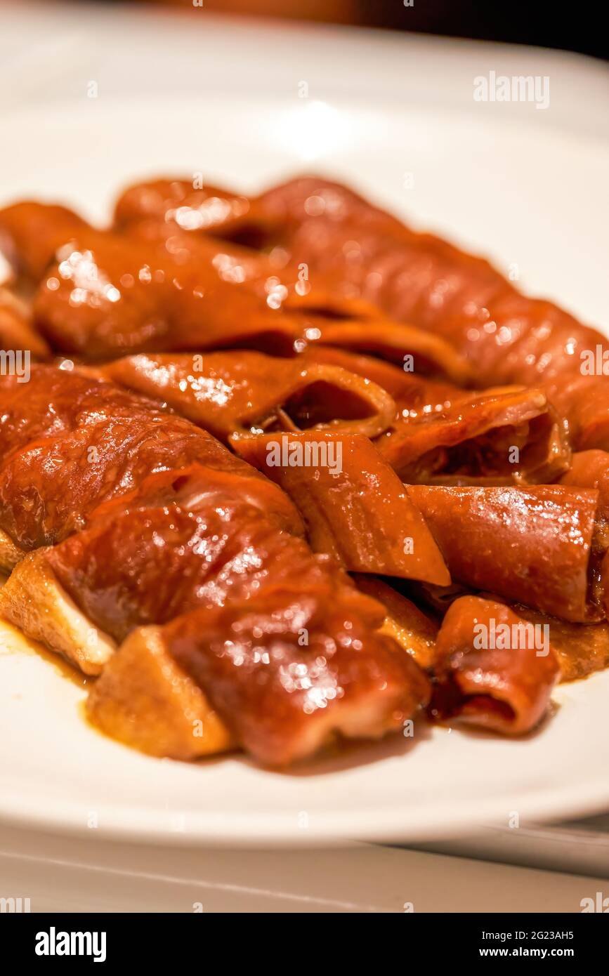 A delicious classic Cantonese dish, soy sauce king pig intestines ...
