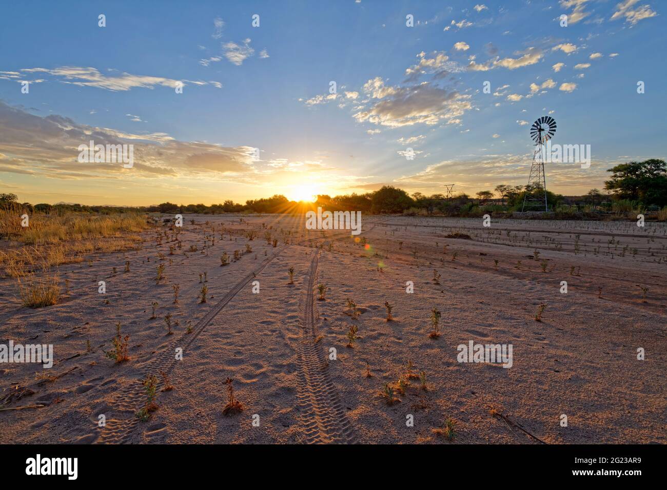 Car track in dry Omaruru river (dry river) near Omaruru, sunset, Erongo ...