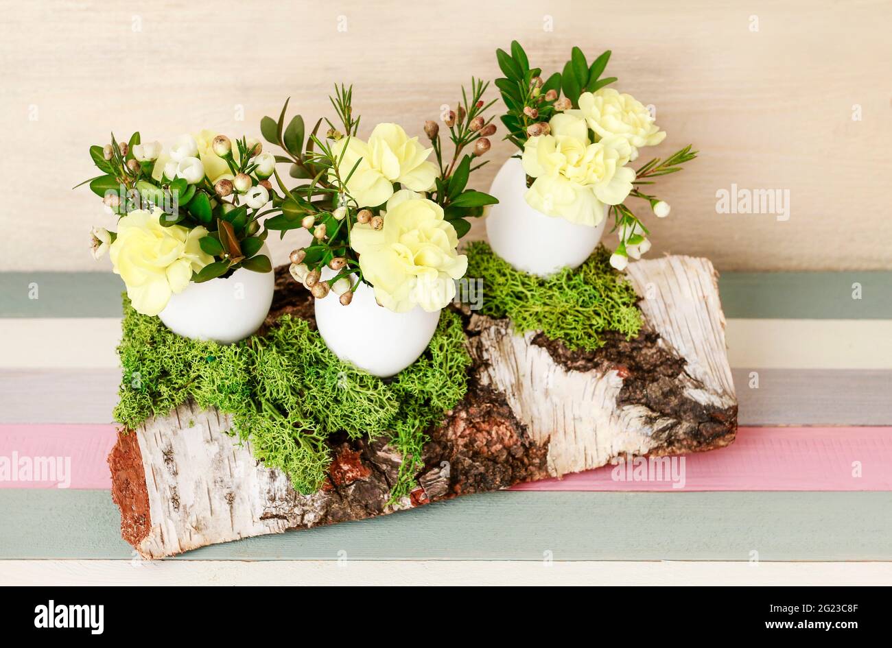 Easter decoration with egg shell, carnation flower, buxus, chamelaucium ...