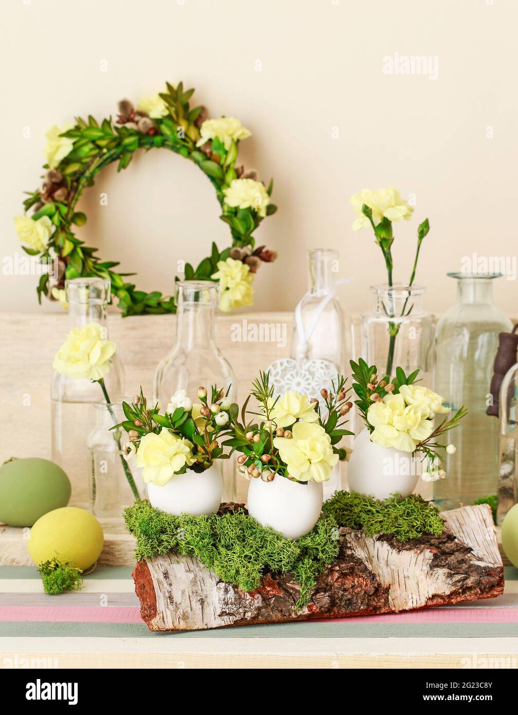 Easter decoration with egg shell, carnation flower, buxus, chamelaucium ...