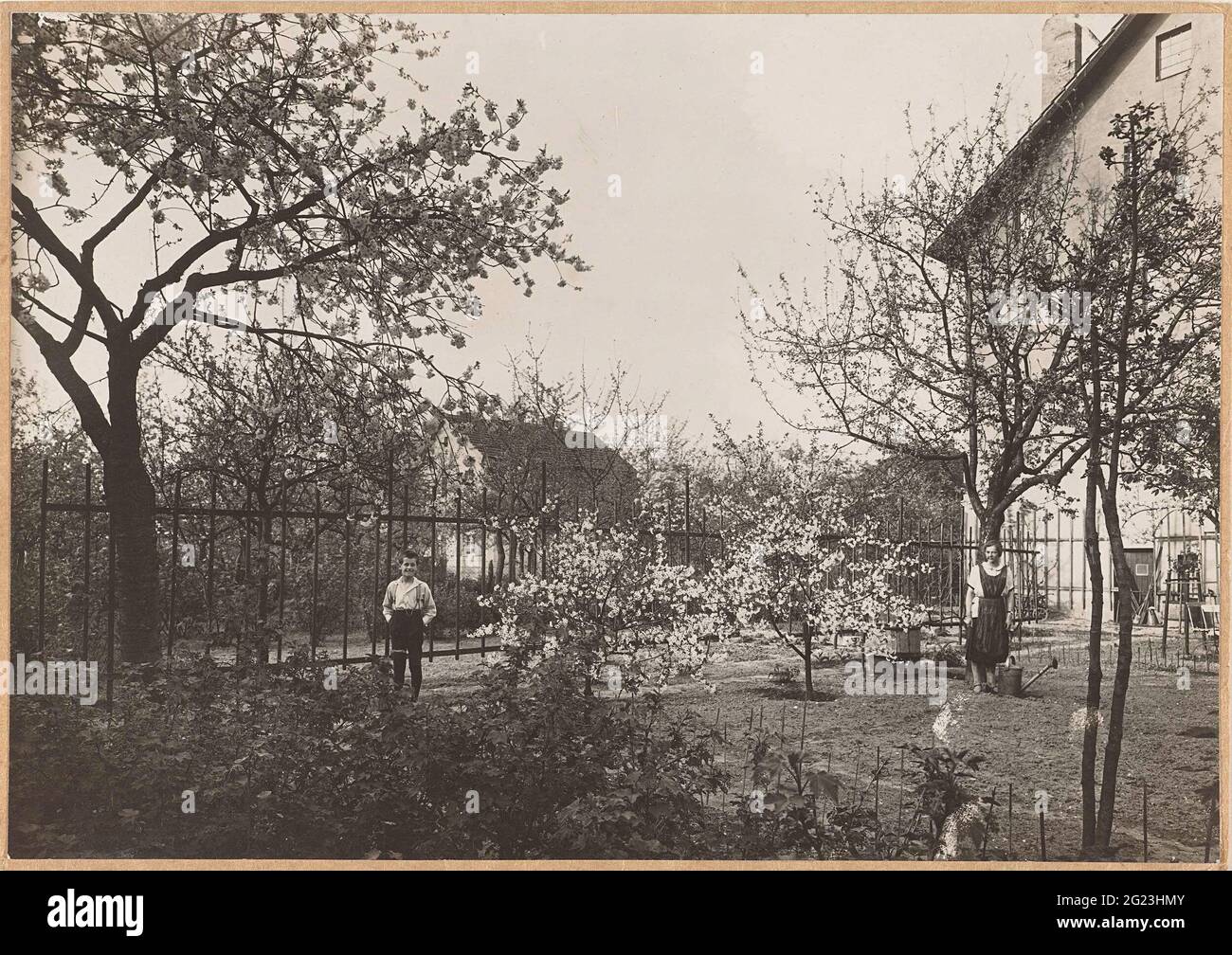 A woman and a boy in a garden, luminear, Berlin Stock Photo - Alamy