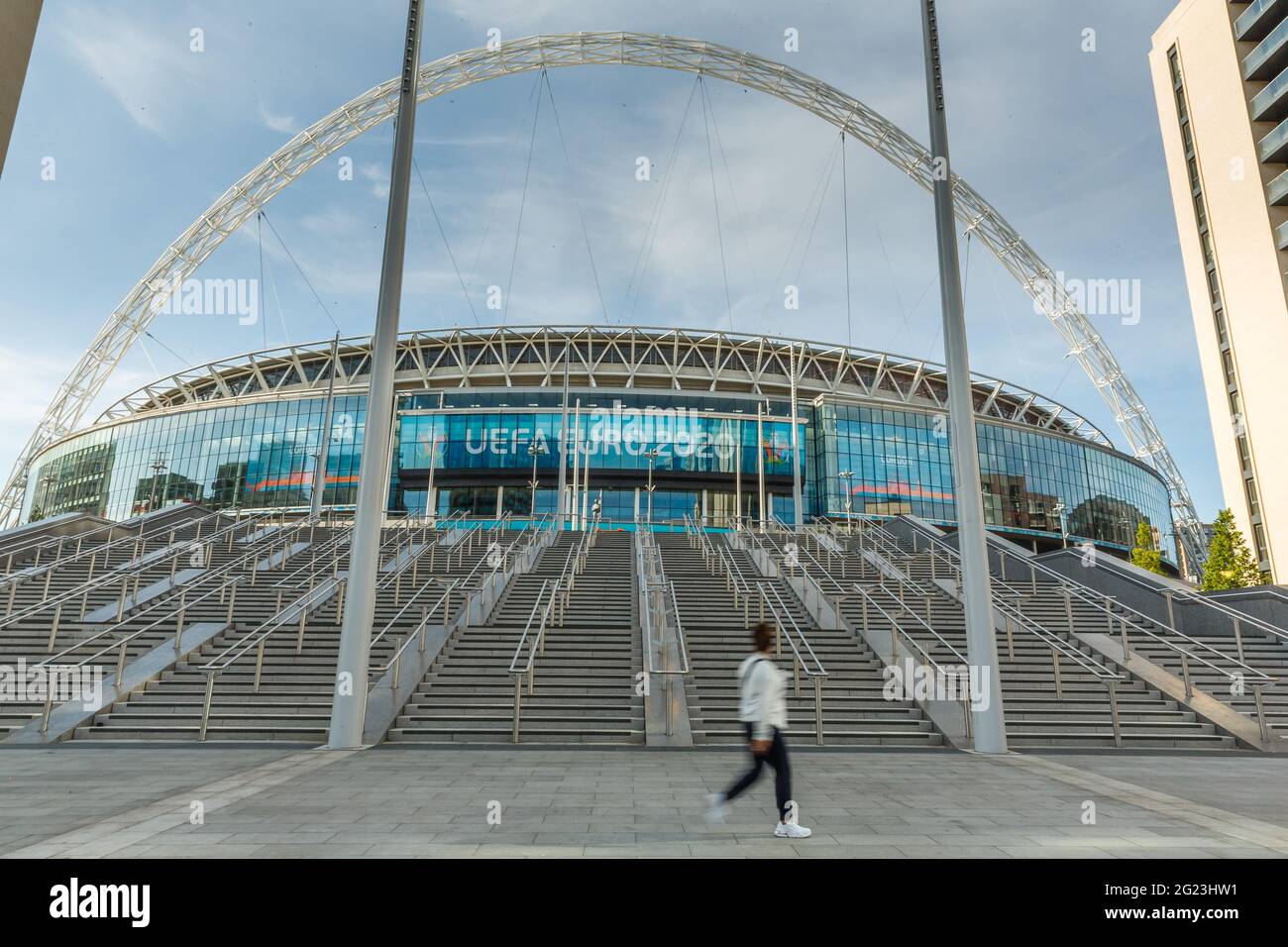 Wembley Stadium, Wembley Park, UK. 8th June 2021. Passers by walk in ...