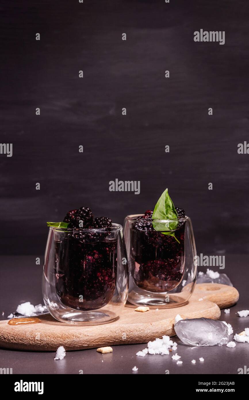 Refreshing blackberry fruit drink. Cold summer berry cocktail, modern ...